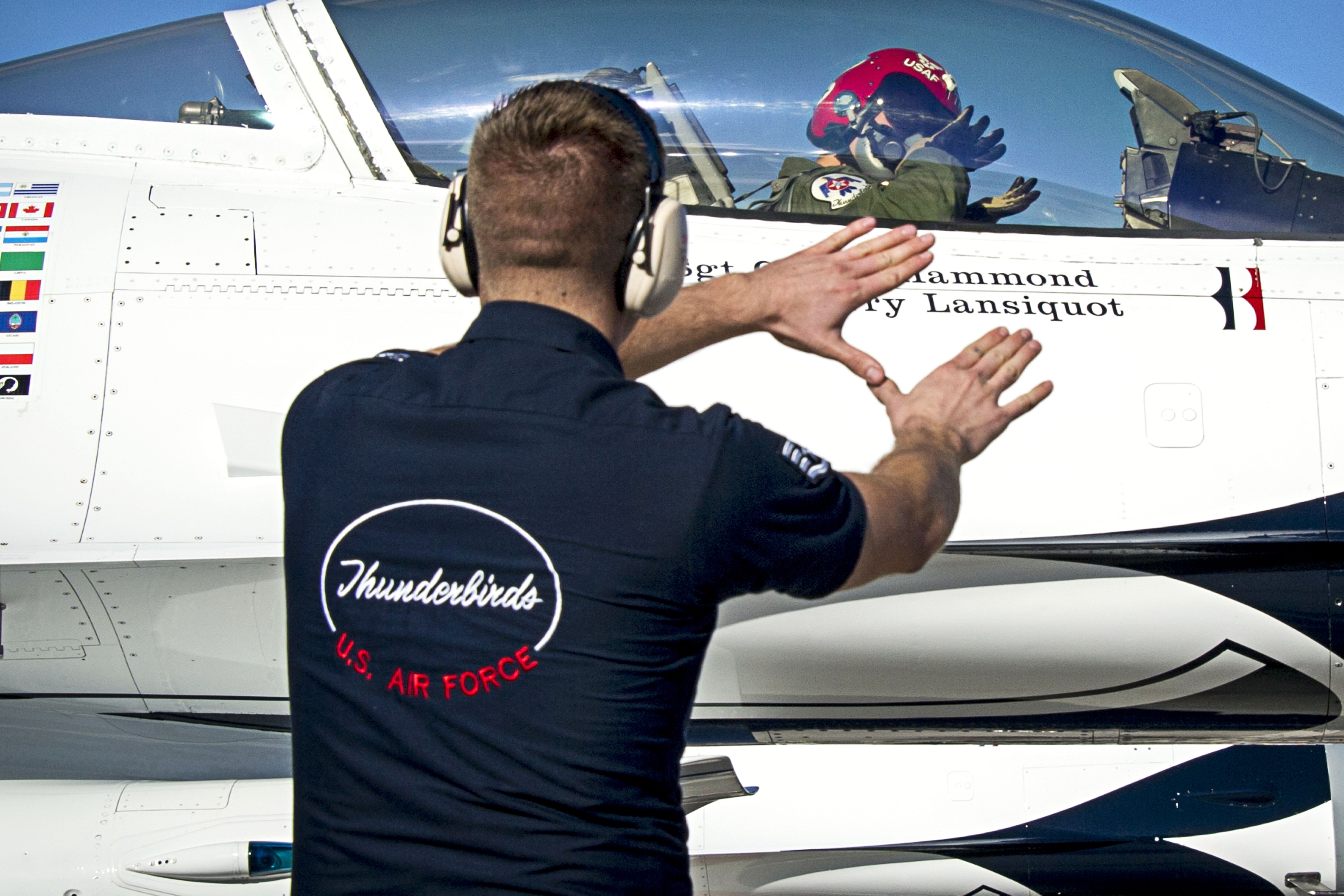 Air Force Staff Sgt. Jacob Worthen, foreground, sends off Air Force ...