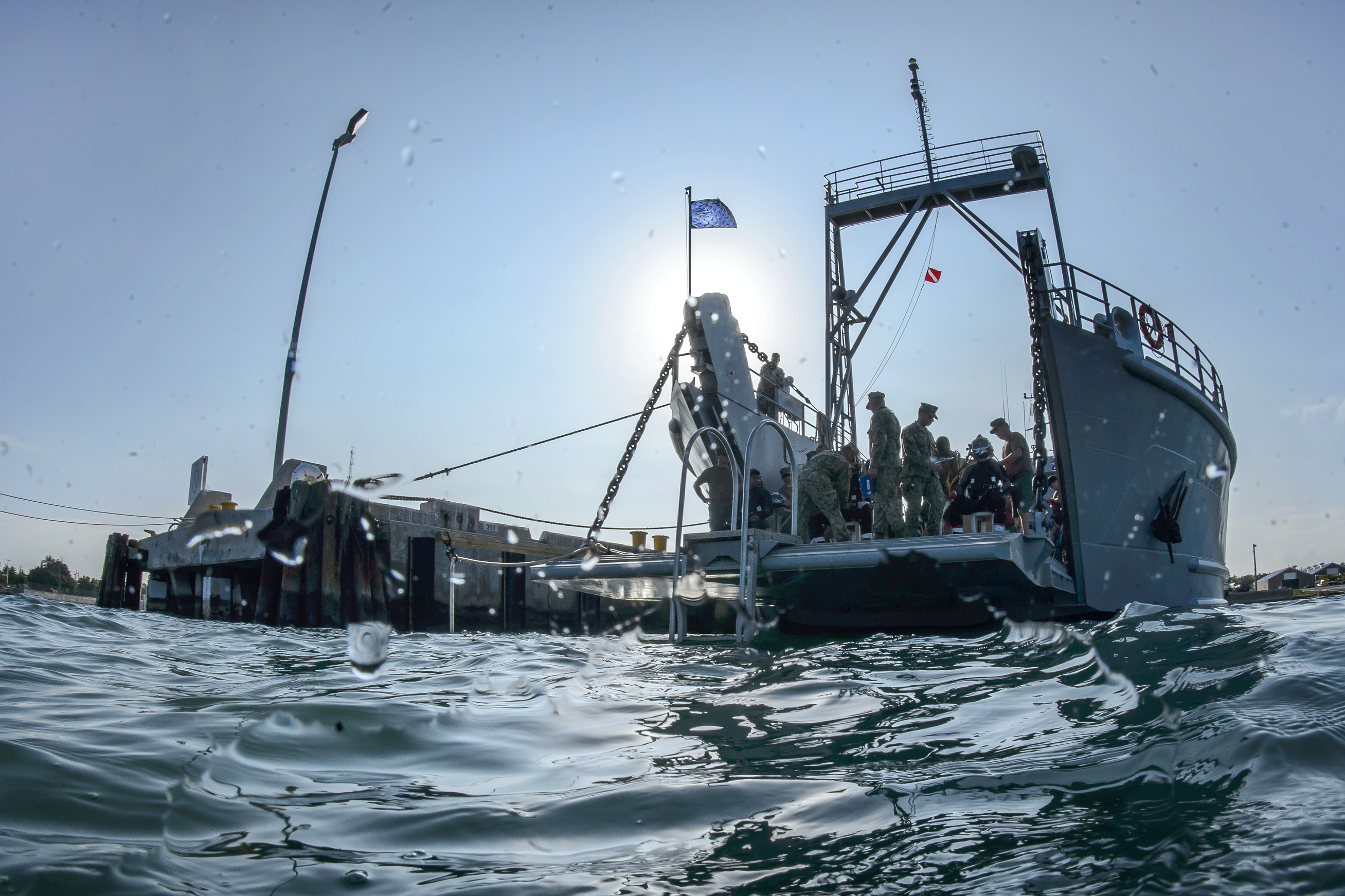 Navy seabee divers conduct surface supplied diving operations during ...