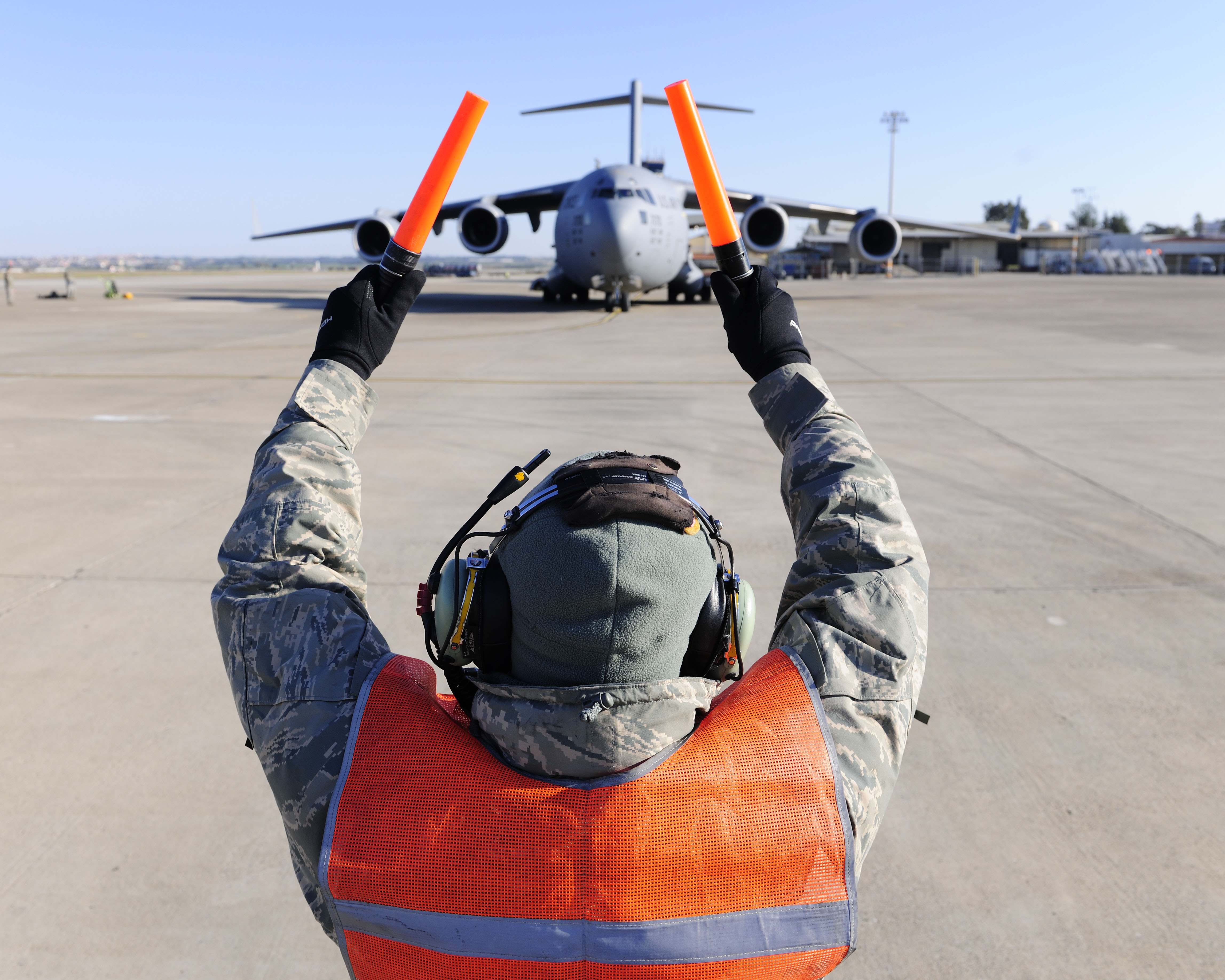 728th Air Mobility Squadron members process cargo from a C-17 ...
