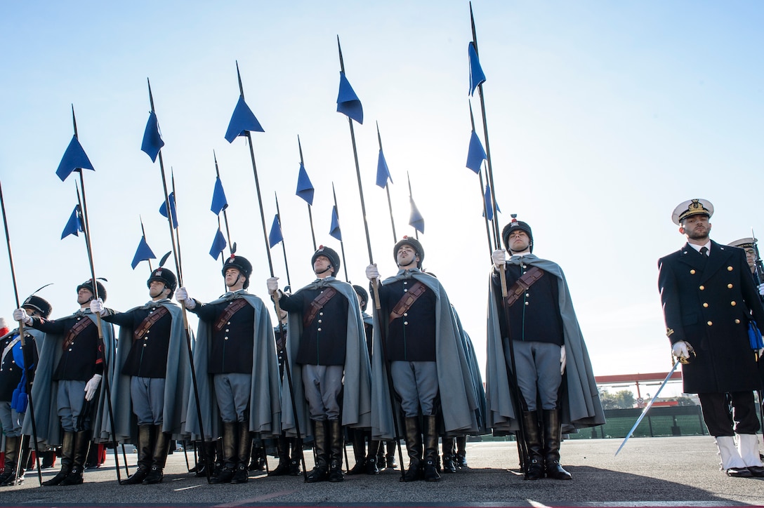An Italian honor guard stands in formation before a pass and review ...