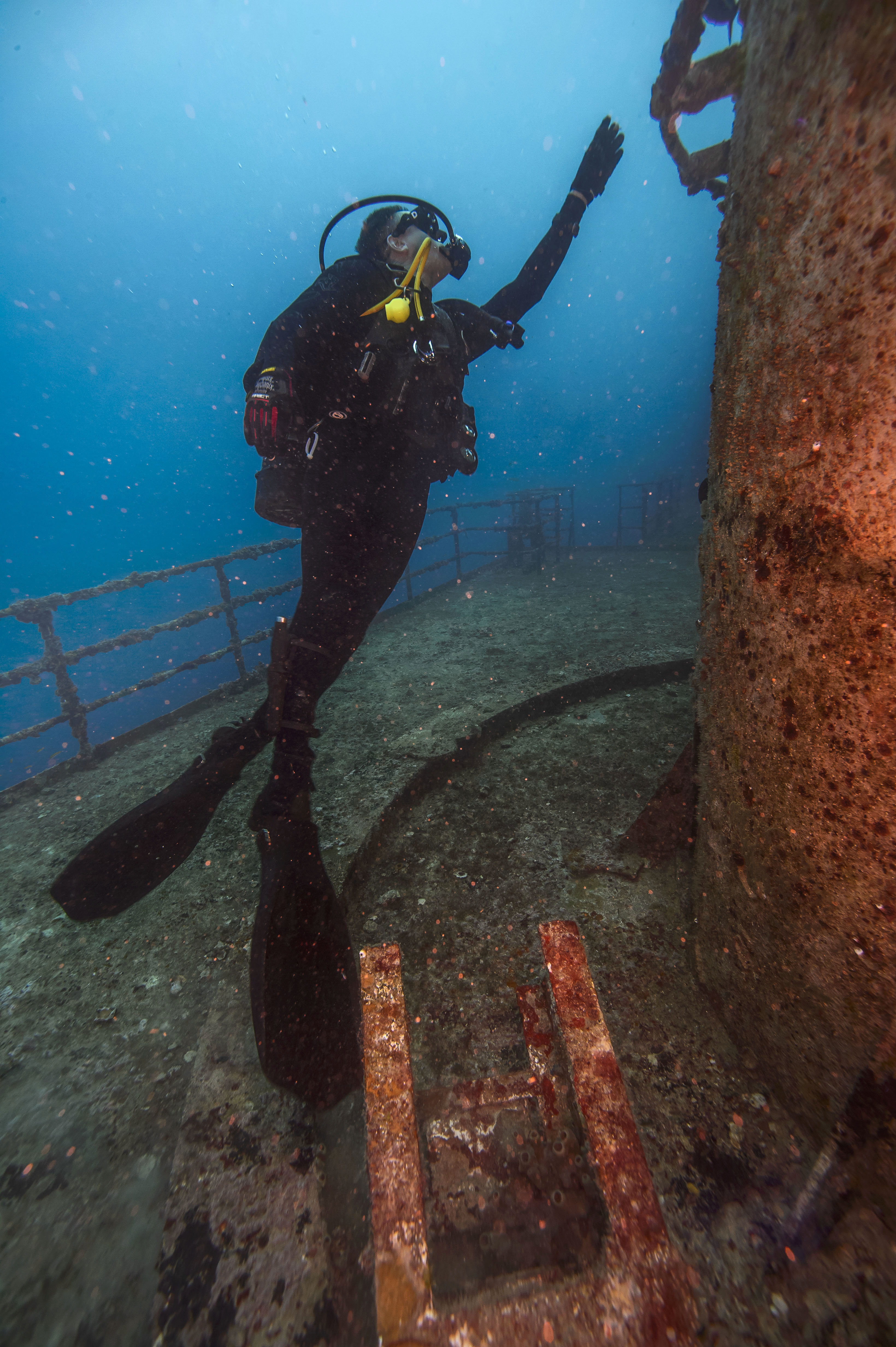 Navy Chief Petty Officer Peter M. David surveys the wreckage of the ...
