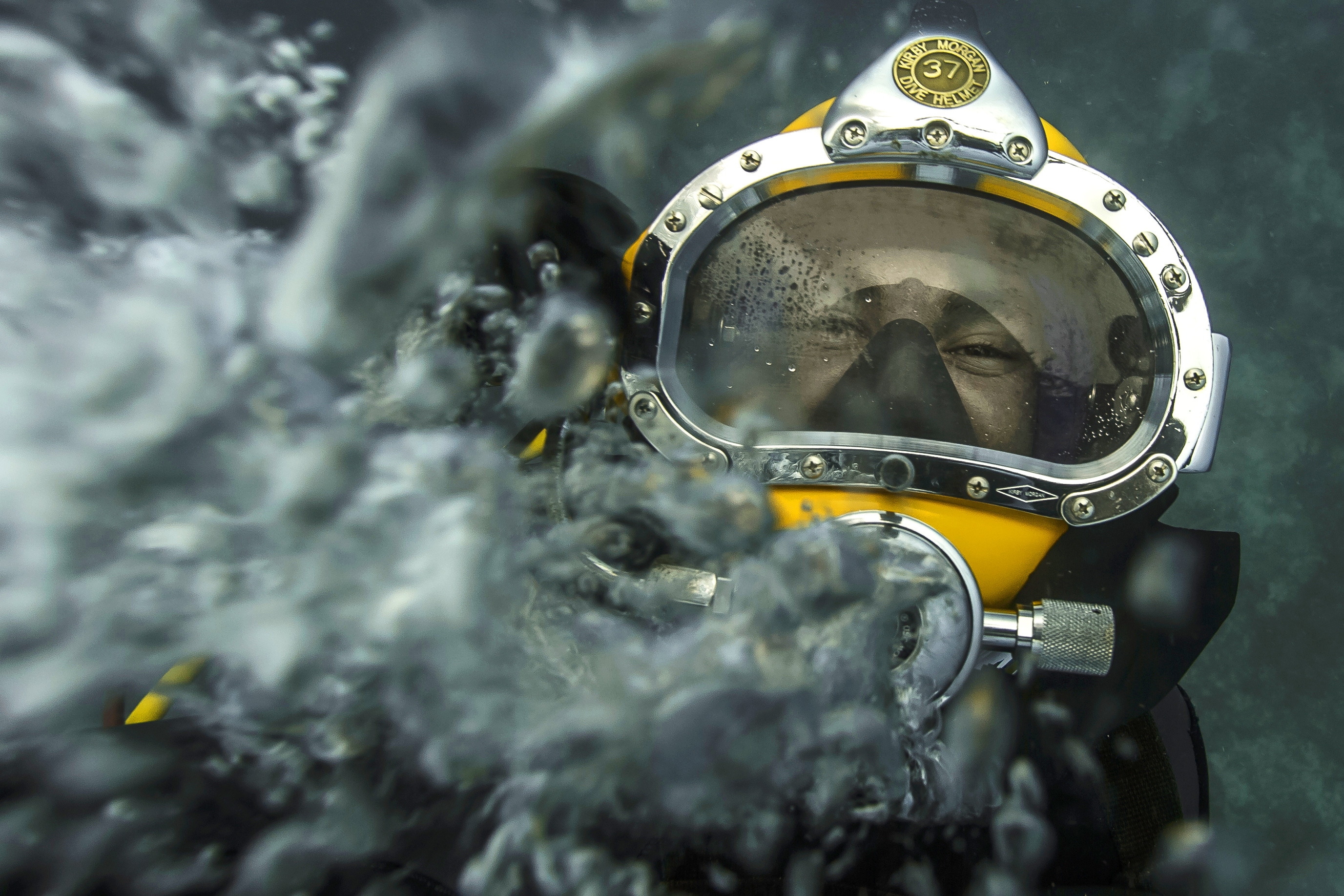 Navy Petty Officer 2nd Class Garrett Snyder conducts surface supplied ...