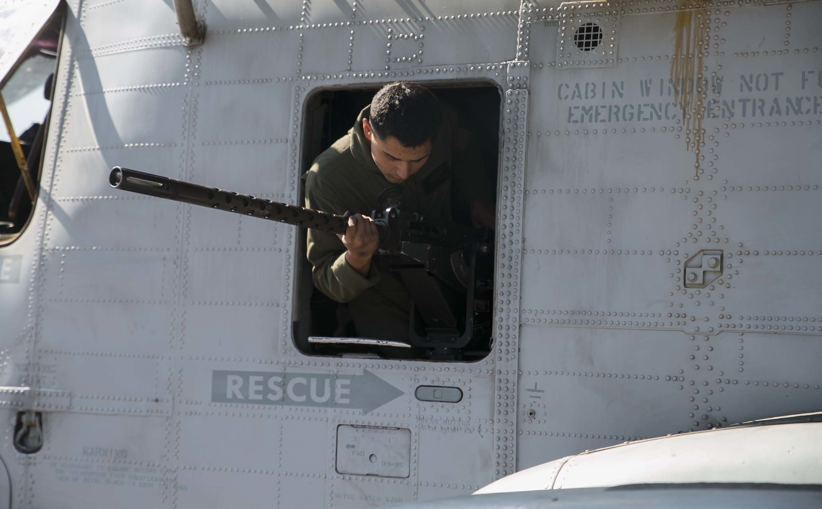 Marines fire machine guns from Super Stallions
