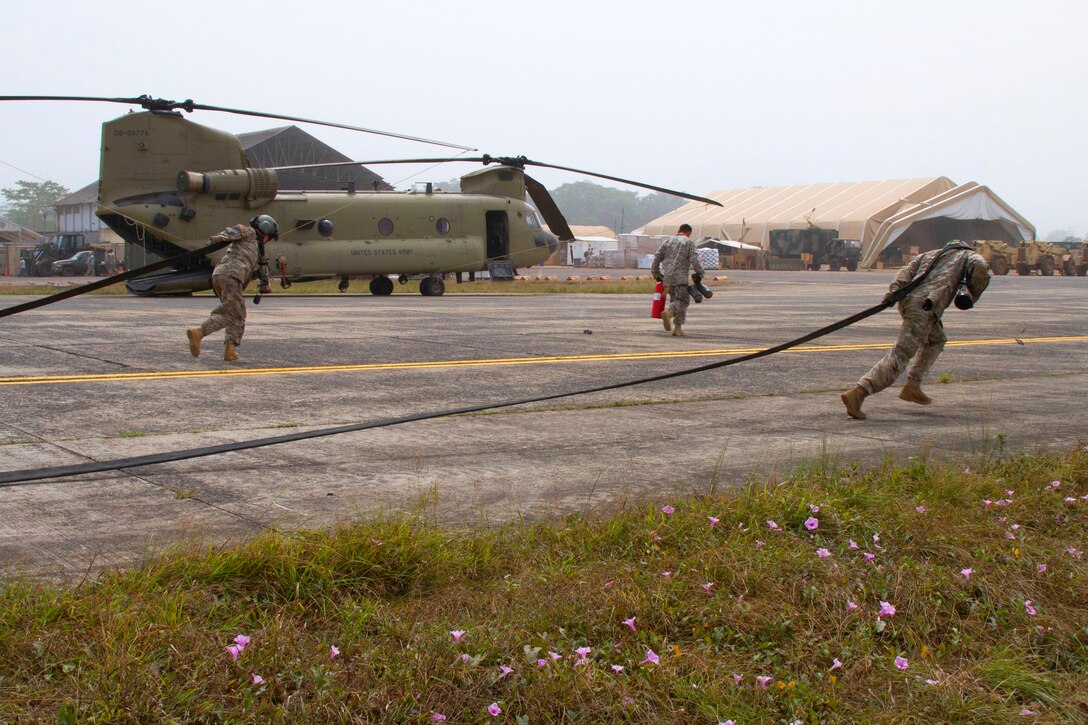 U.S. Army Spc. Danielle Taylor, left, and U.S. Army Spc. Dustin Atkin ...