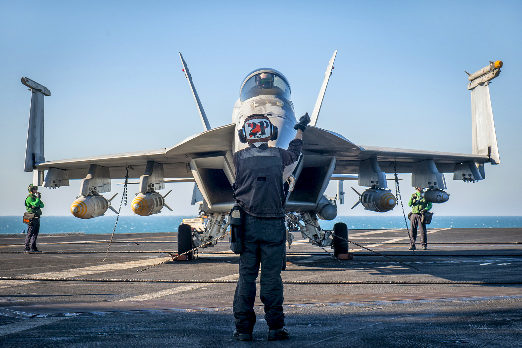 U.S. Navy Seaman Dylan Donley conducts engine startups for an F/A-18E ...