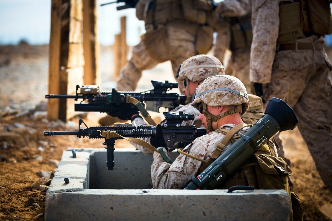Marines aim down range during simulated machine gun fire at Range 104 ...