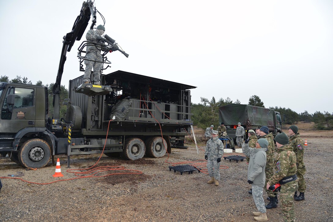U.S. paratroopers test the Slovenian army decontamination equipment ...