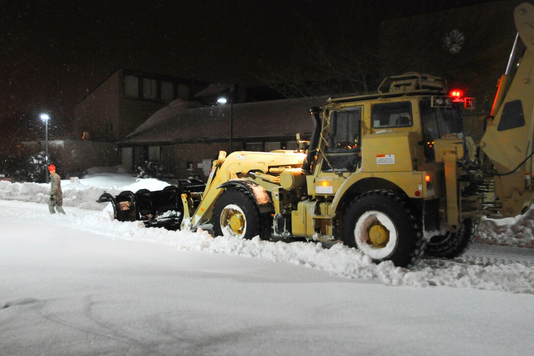 U.S. Army Spc. John O’Brien guides a snow plow during Winter Storm Juno ...
