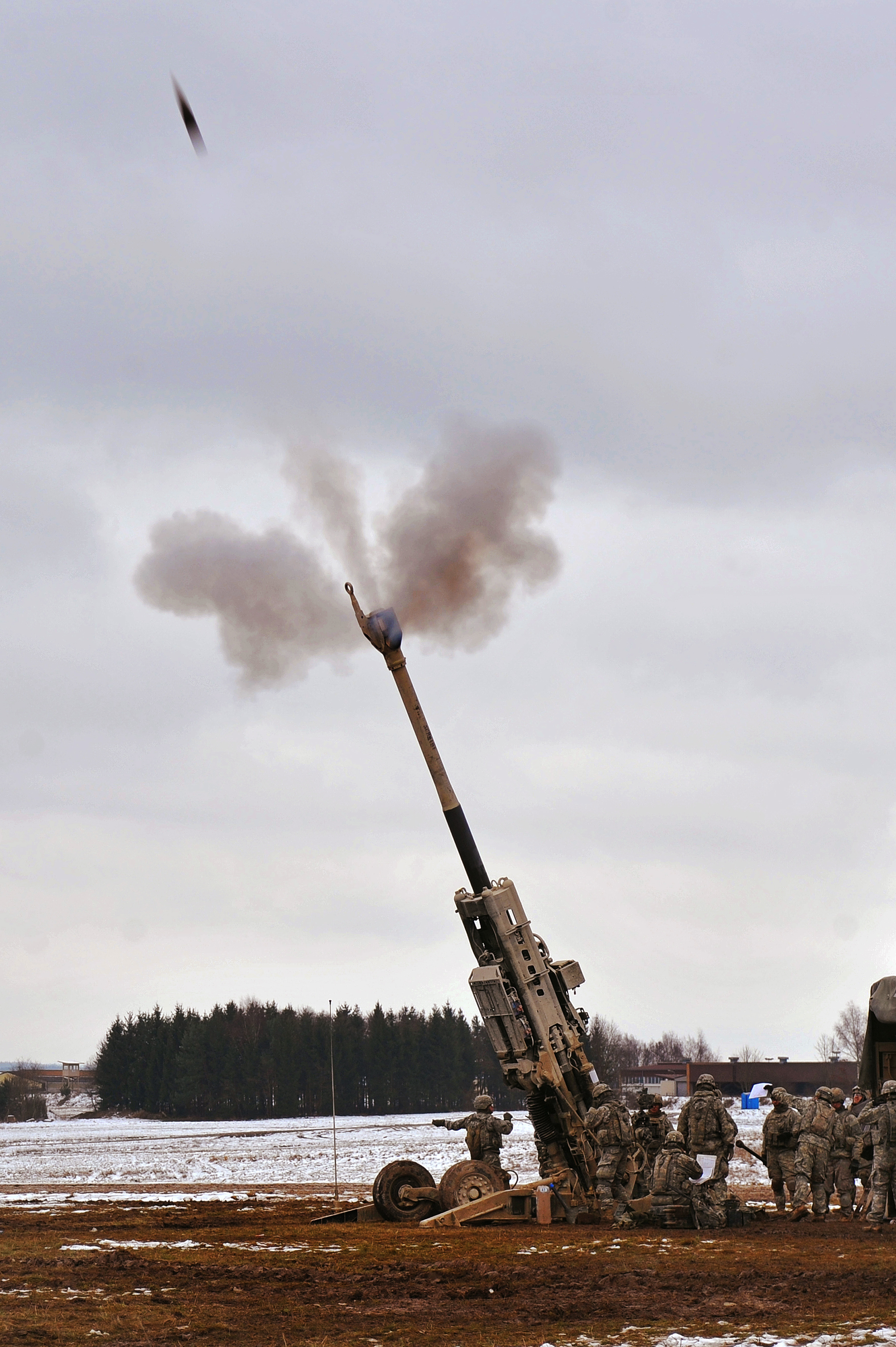 U.S. troopers conduct a mass fire mission with M777 howitzers during ...