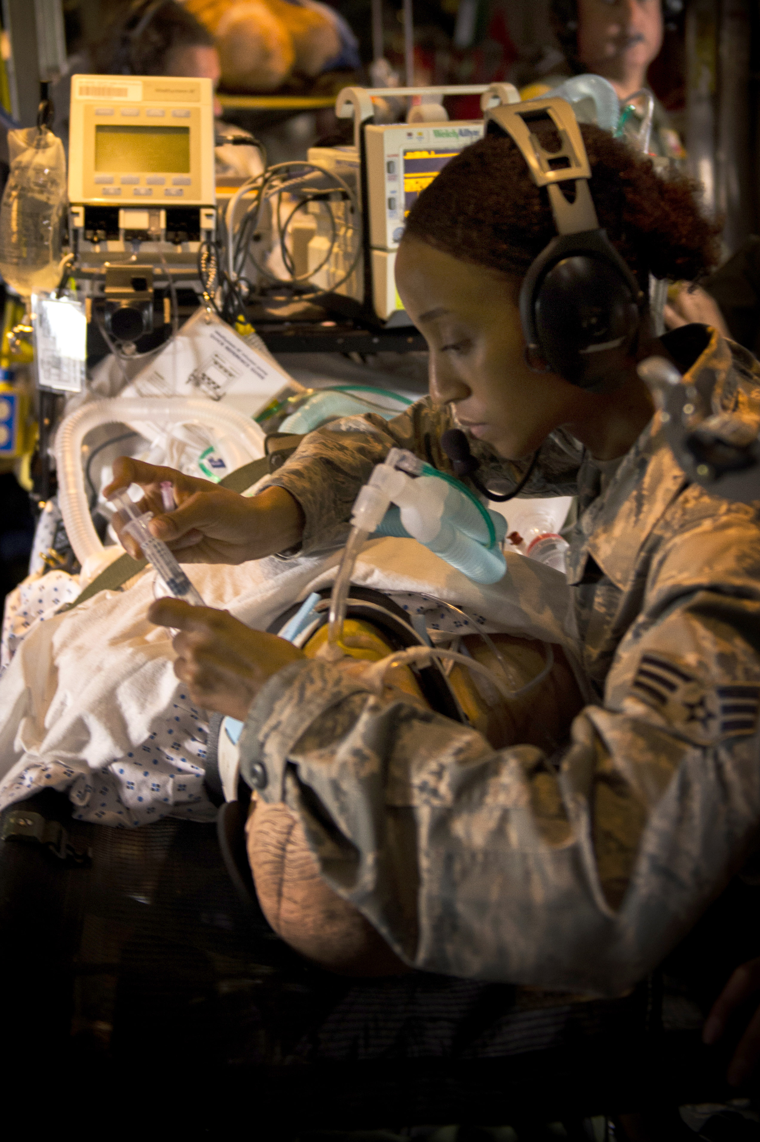 Air Force Senior Airman Jasmine Simms treats a simulated wounded ...