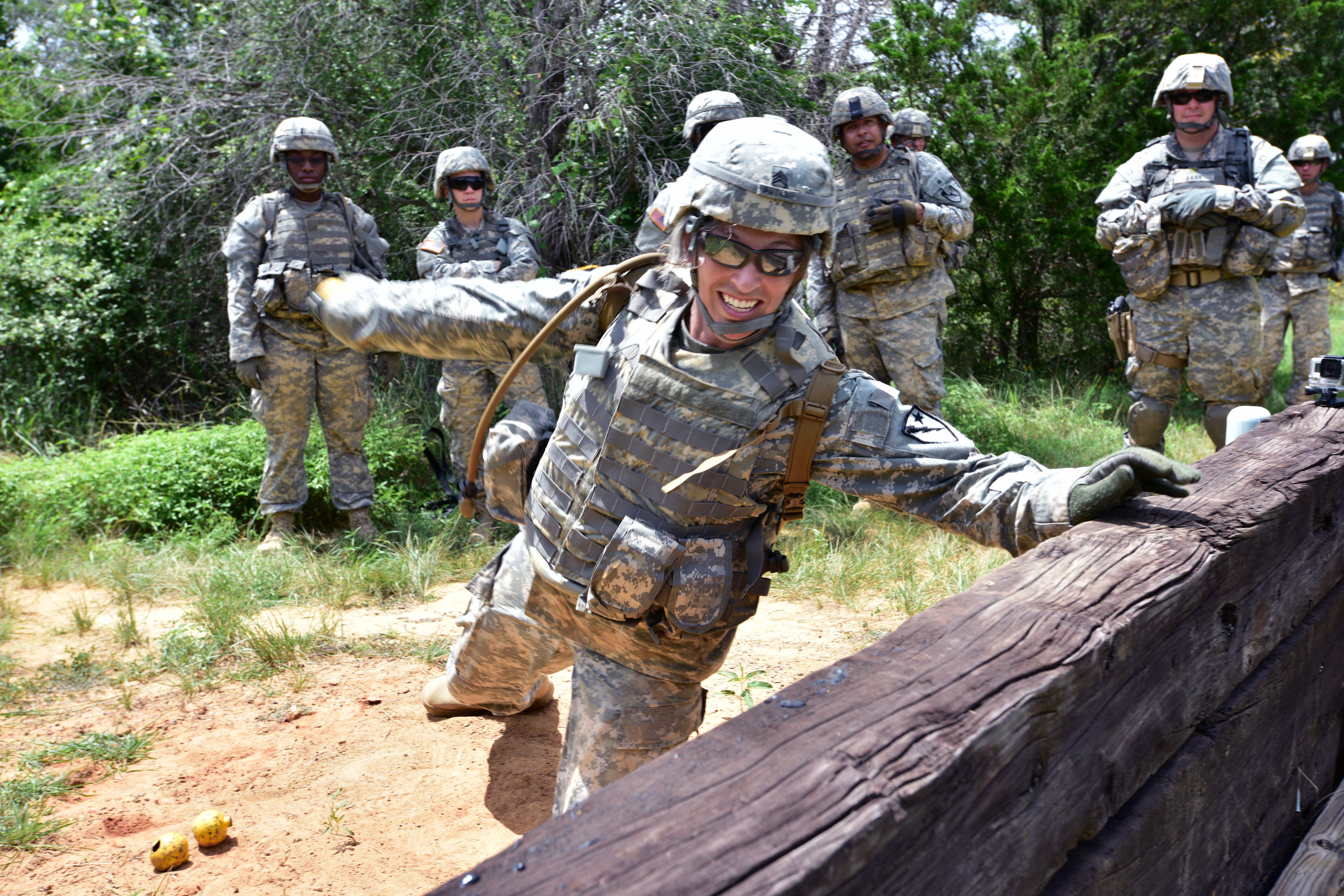A Texas National Guard soldier prepares to toss a practice grenade during pre-mobilization ...