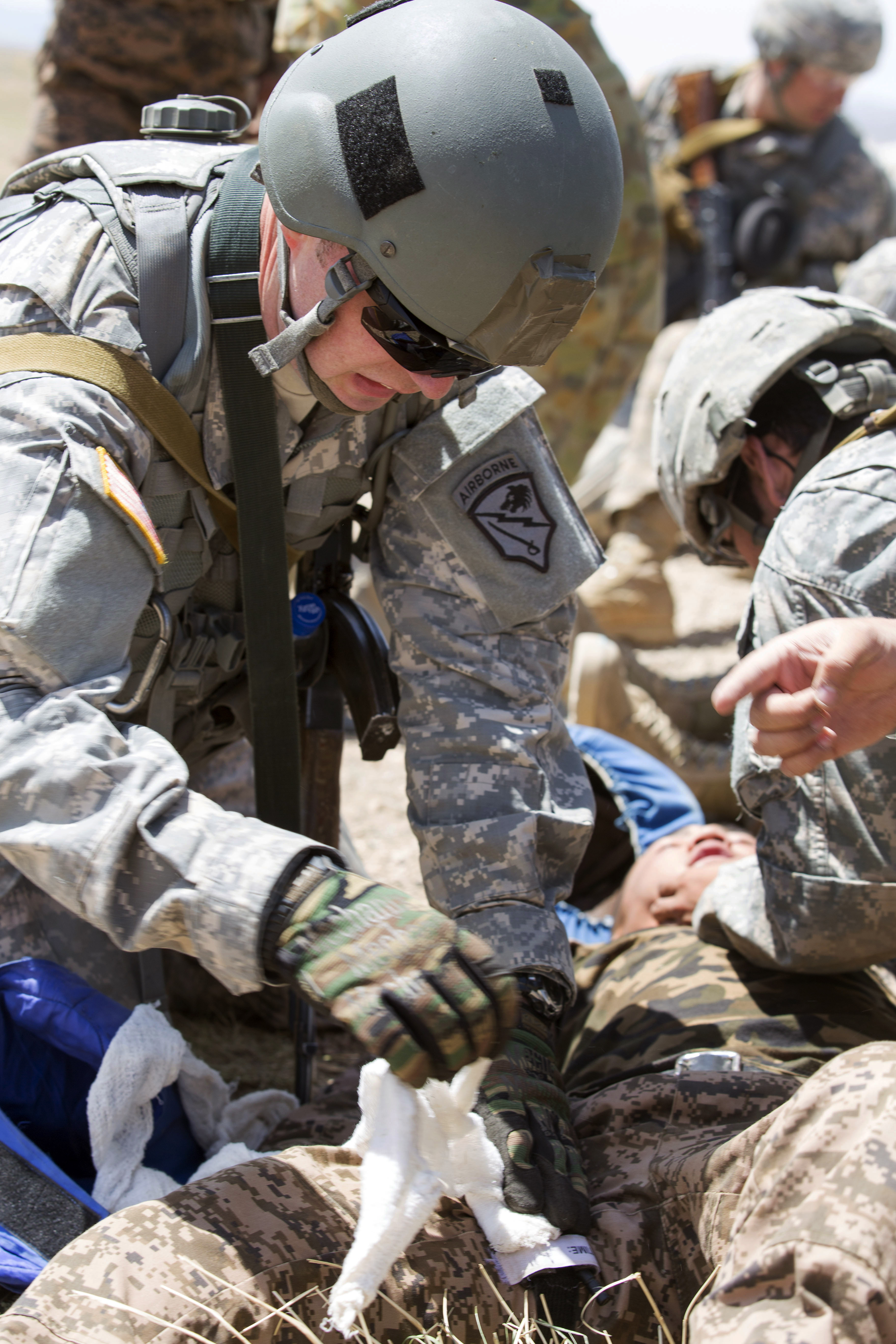 U.S. Army Spc. Matthew Millette treats a simulated casualty during ...