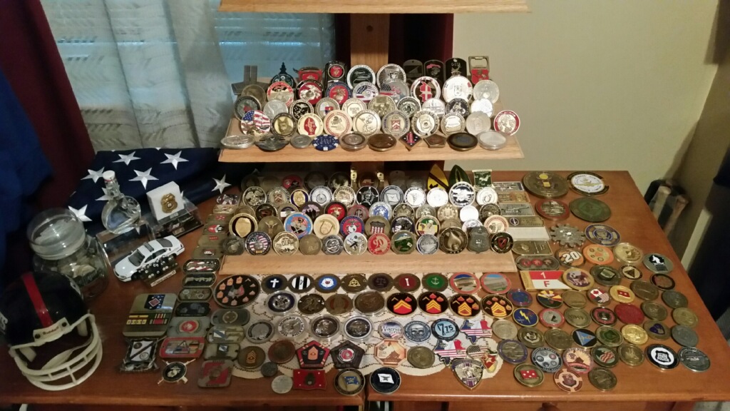 Challenge coin collection represents career for PMO Officer