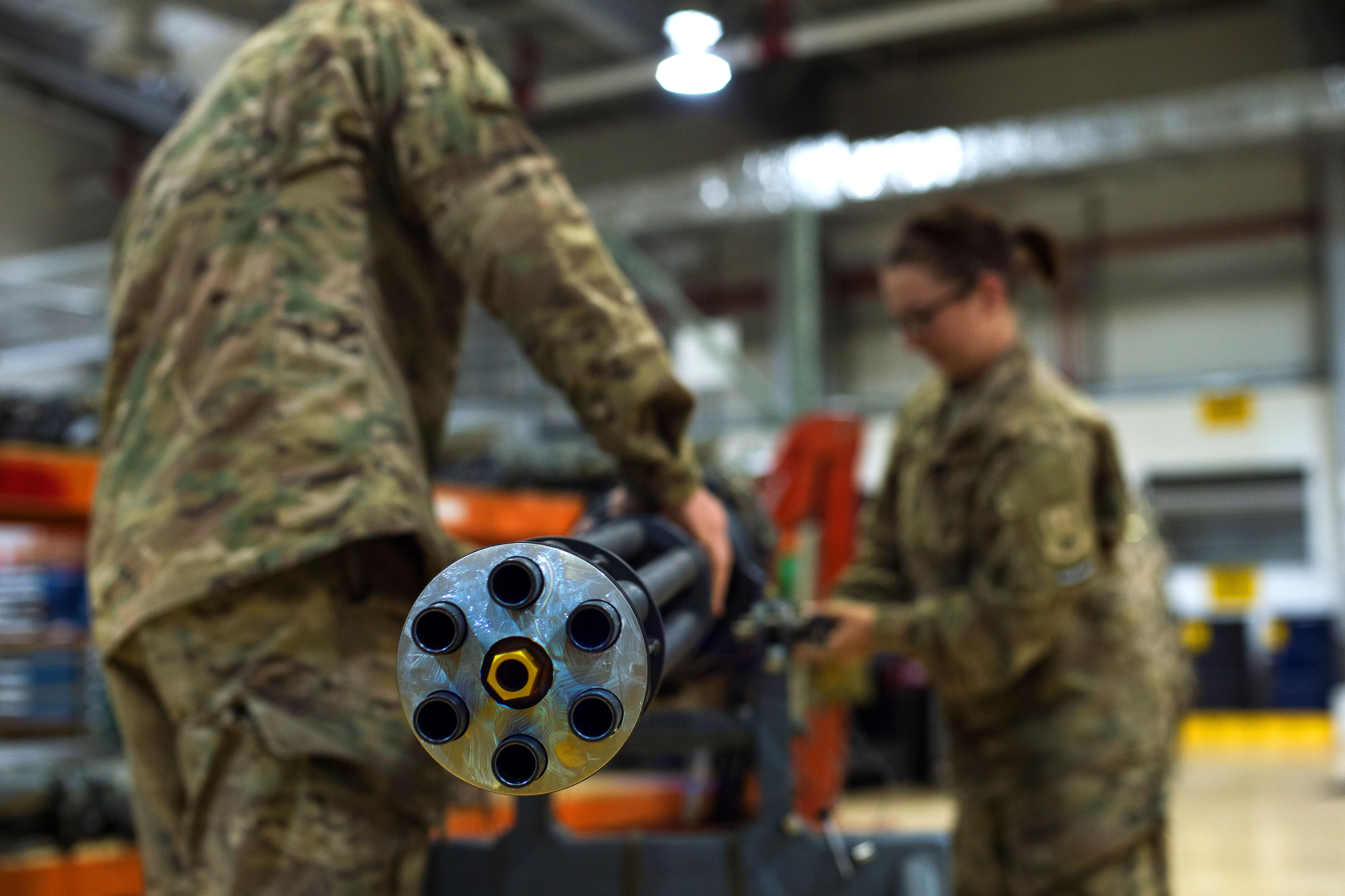 U.S. airmen inspect an F-16 Fighting Falcon 20mm Gatling gun on Bagram ...