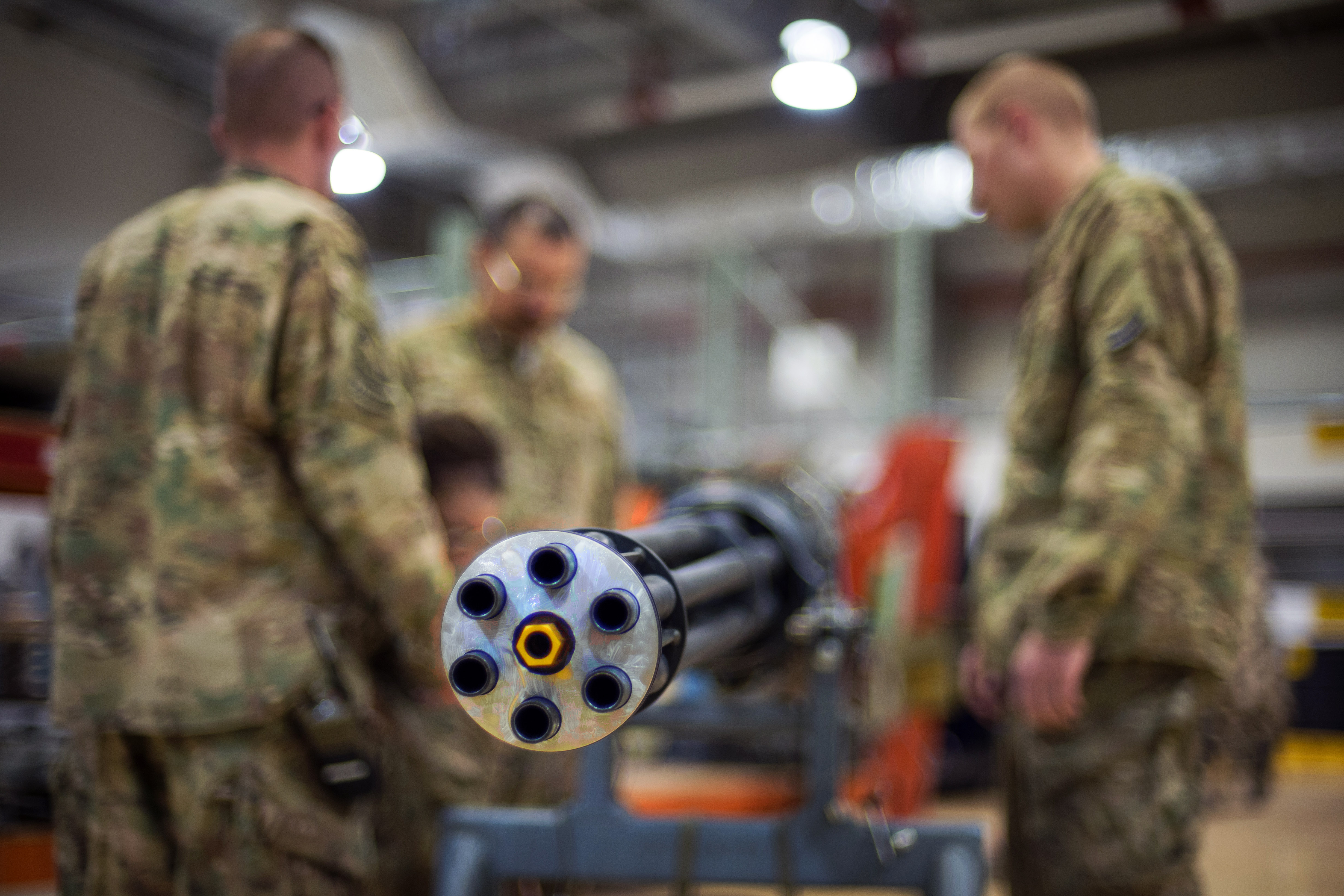 U.S. airmen inspect an F-16 Fighting Falcon 20mm Gatling gun on Bagram ...