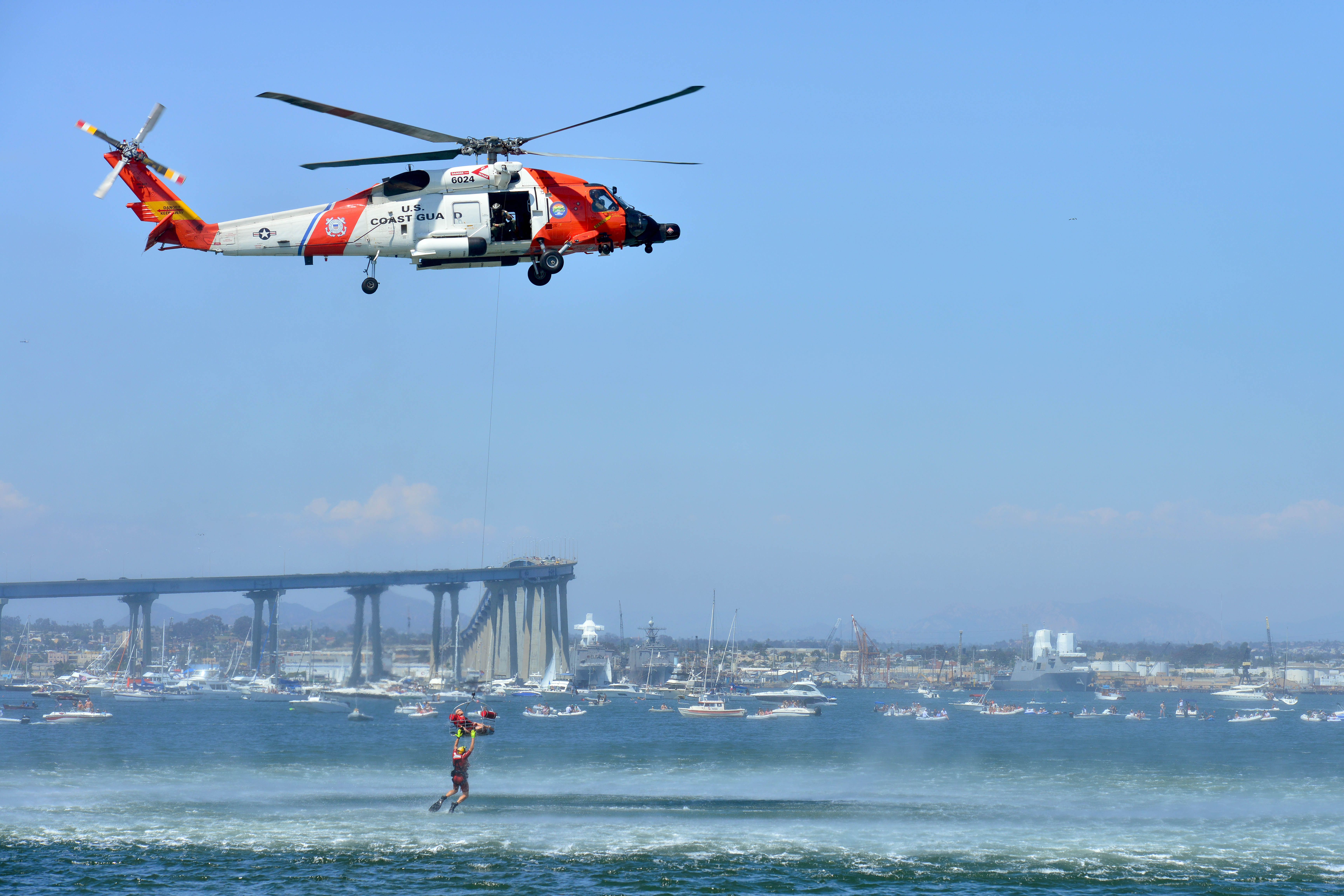 Coast Guard Petty Officer 2nd Class Ryan Pierce steadies a rescue ...