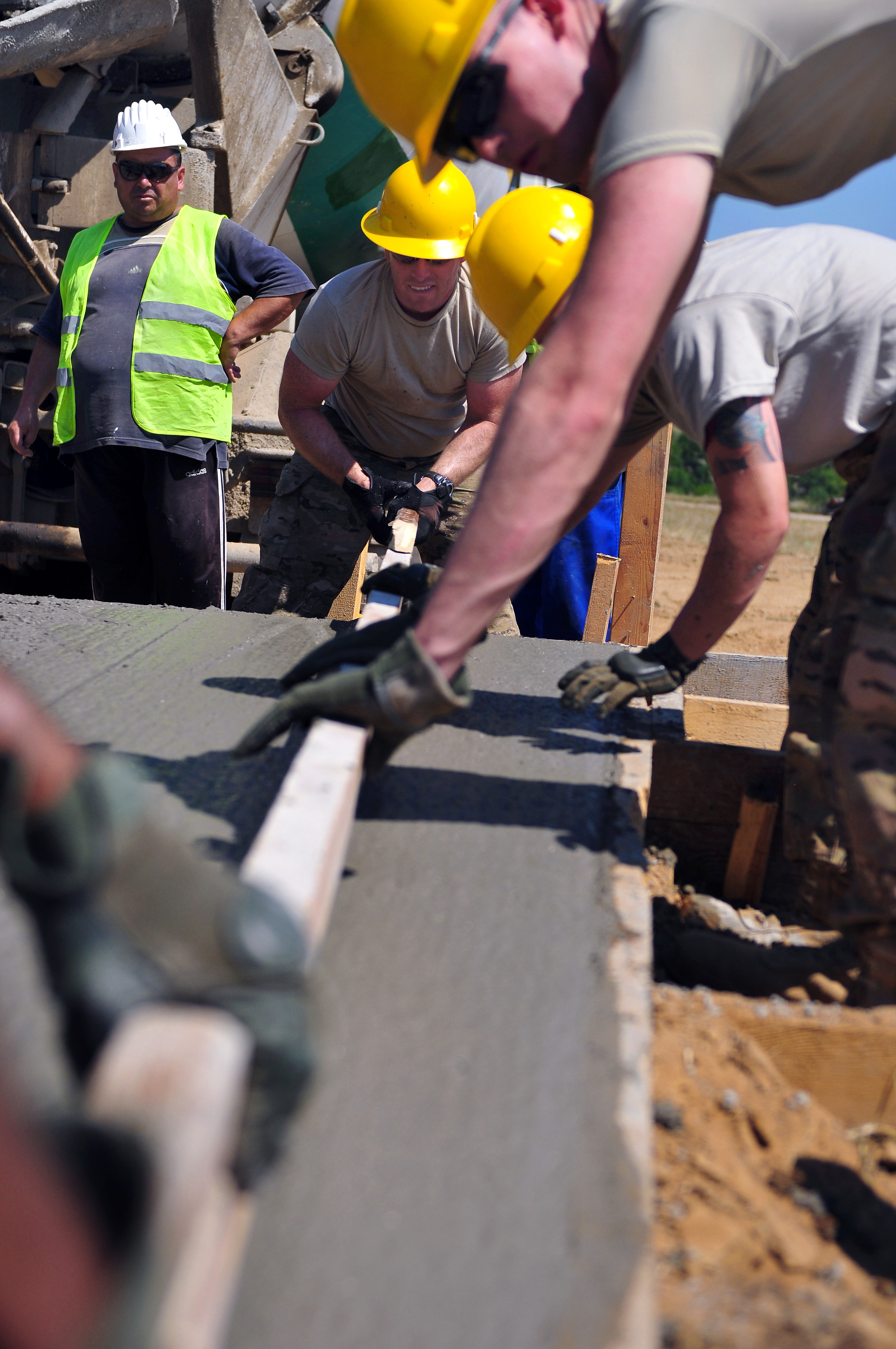 U.S. Army Sgt. Lance Shavchuck and fellow soldiers perform construction ...