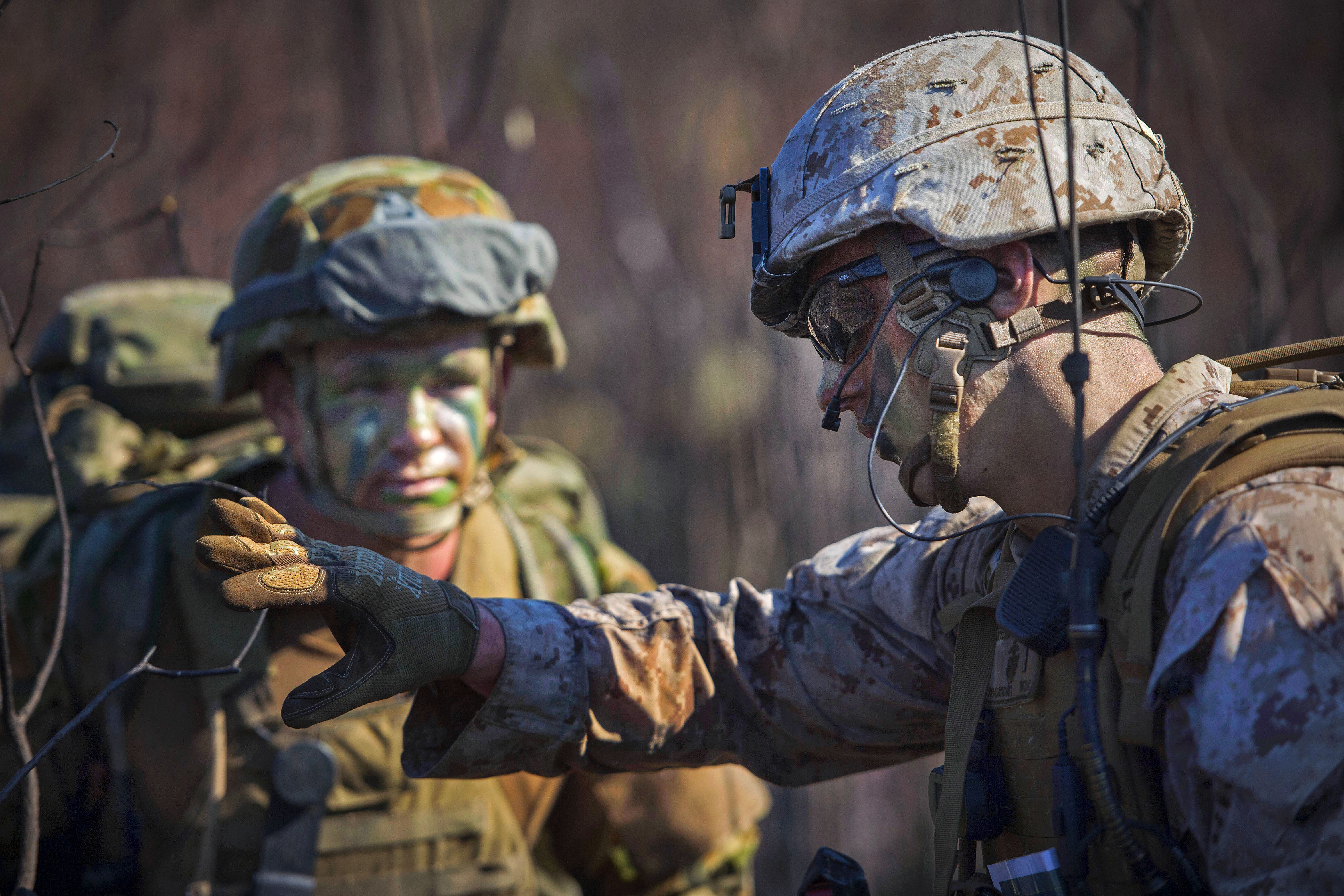 U.S. Marine Corps 1st Lt. Carson Fletcher, right, talks with an ...