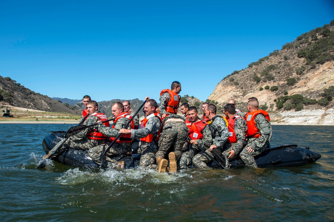 Soldiers row a Zodiac boat on Lopez Lake, Calif., after a helicopter ...