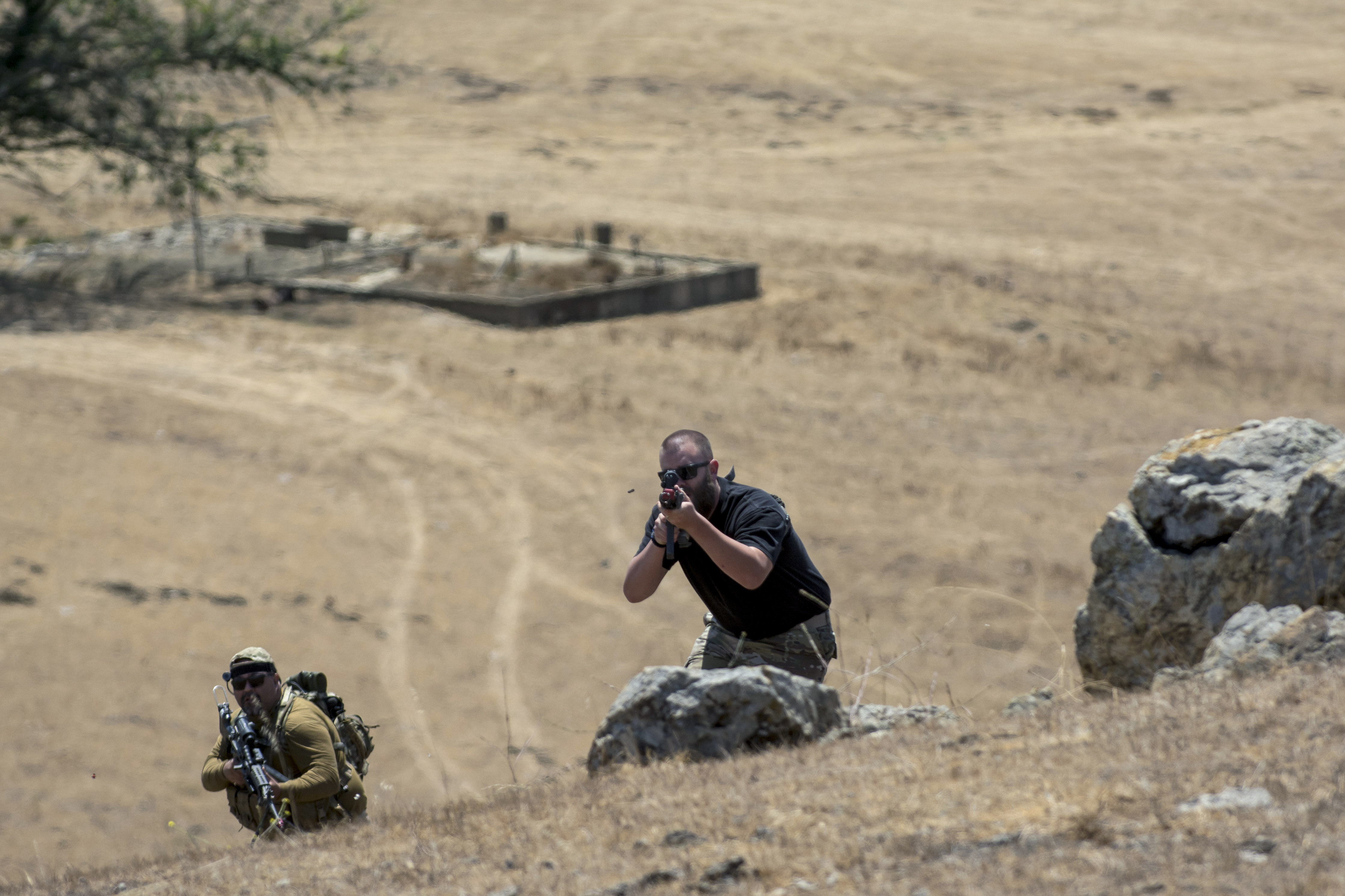 Role-playing enemy forces attack during an air assault landing exercise ...