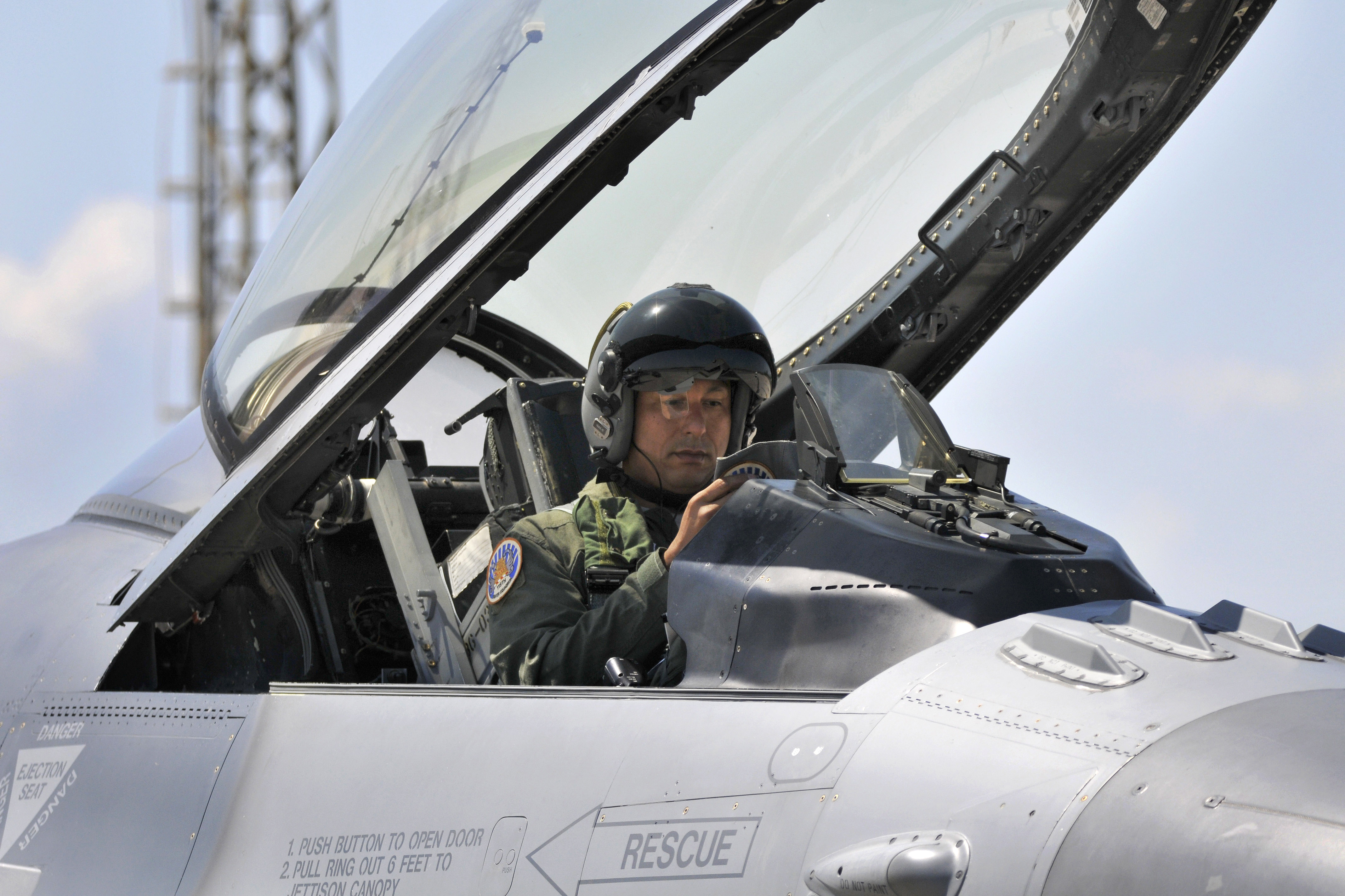 U.S. Air Force Lt. Col. Philippe Malebranche prepares to stow aircrew ...