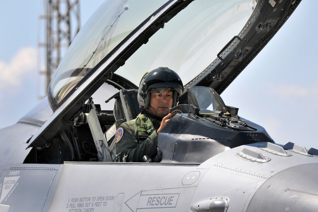 U.S. Air Force Lt. Col. Philippe Malebranche prepares to stow aircrew ...