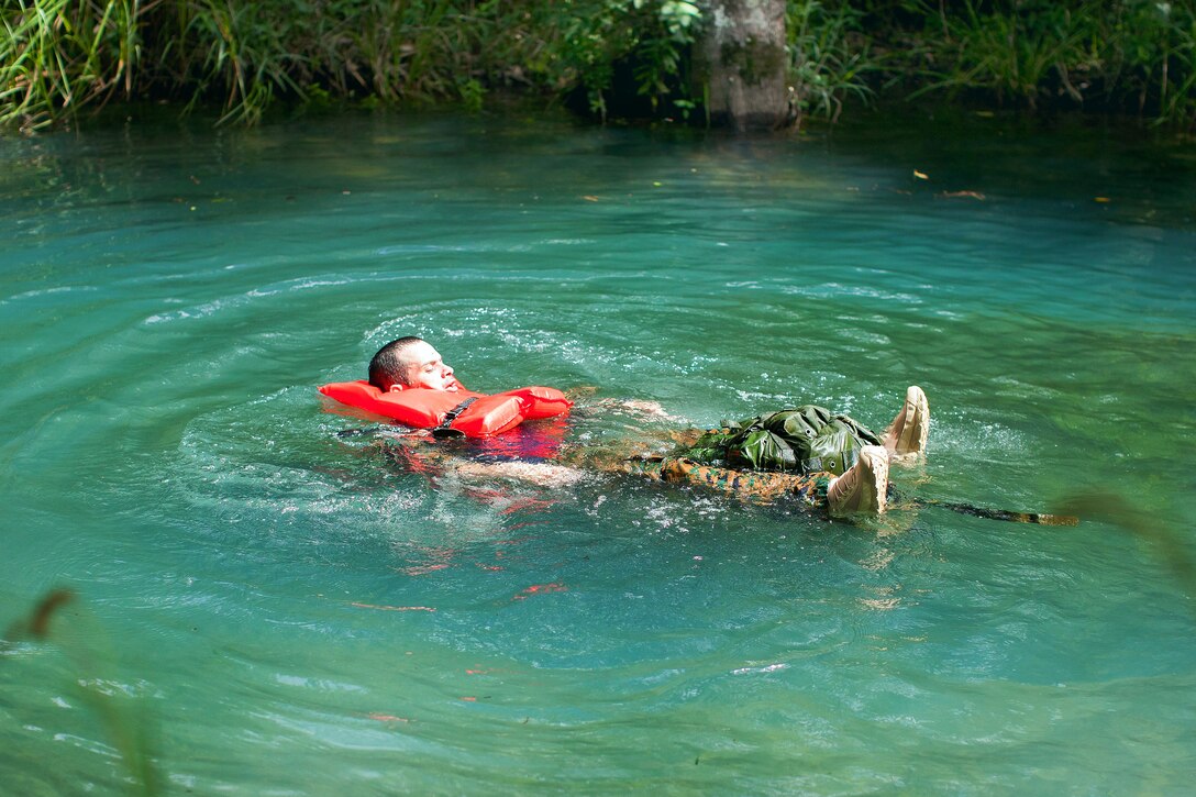 A member of the Costa Rican special intervention unit competes in the ...