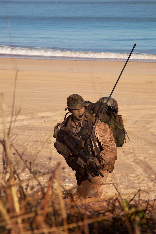 A U.S. Marine scouts a landing beach before coalition troops conduct an ...