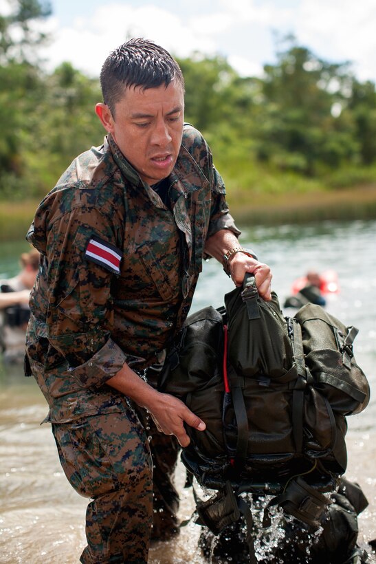 A member of the Costa Rican special intervention unit prepares to run ...