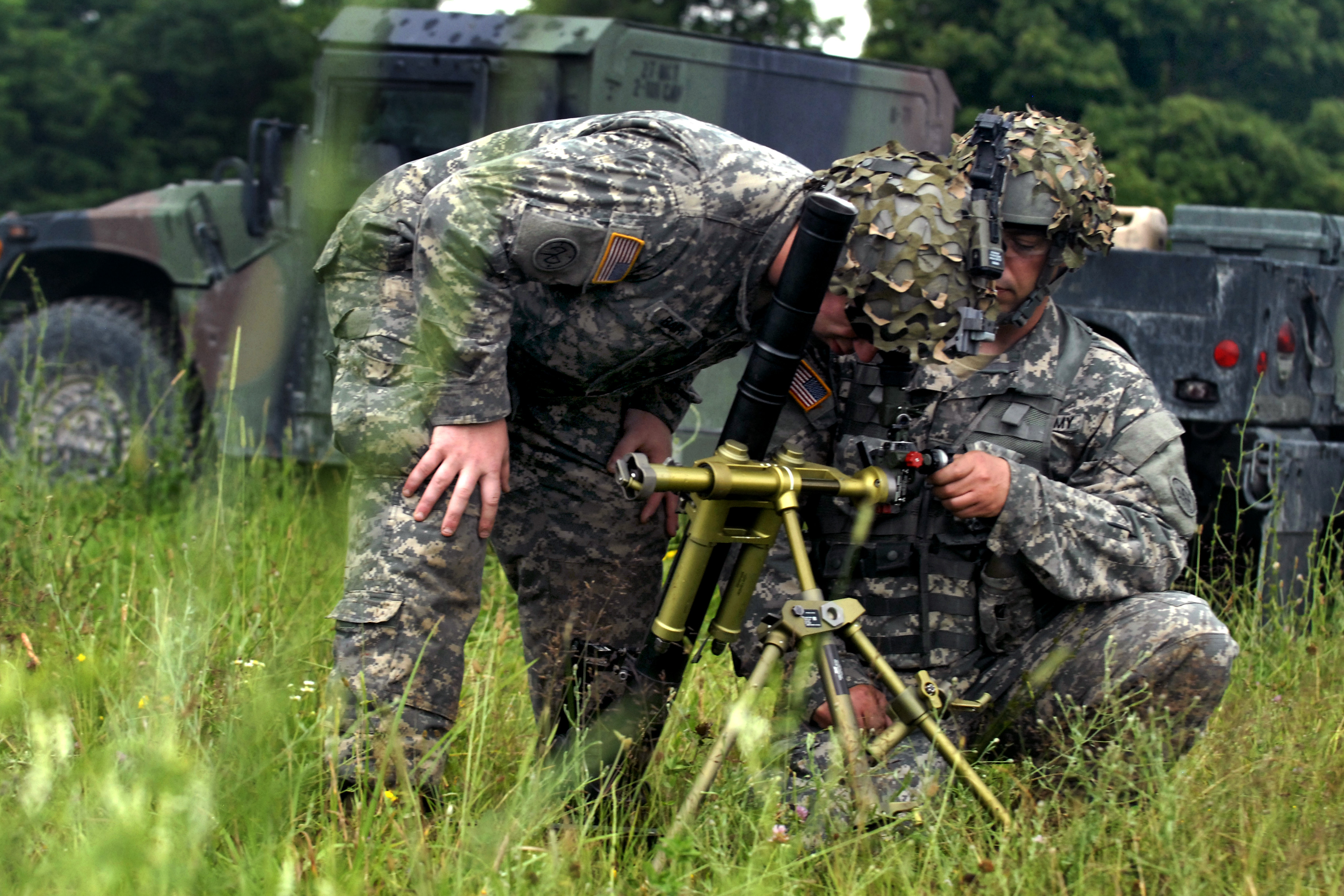 Soldiers Adjust A 60 Mm M224 Mortar During A Live Fire Part Of An