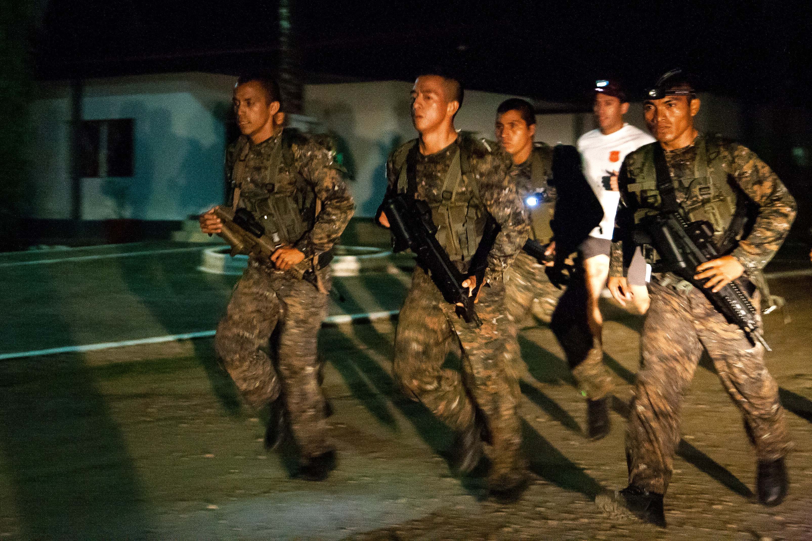Members of Guatemala's special forces, known as Kaibiles, race to ...