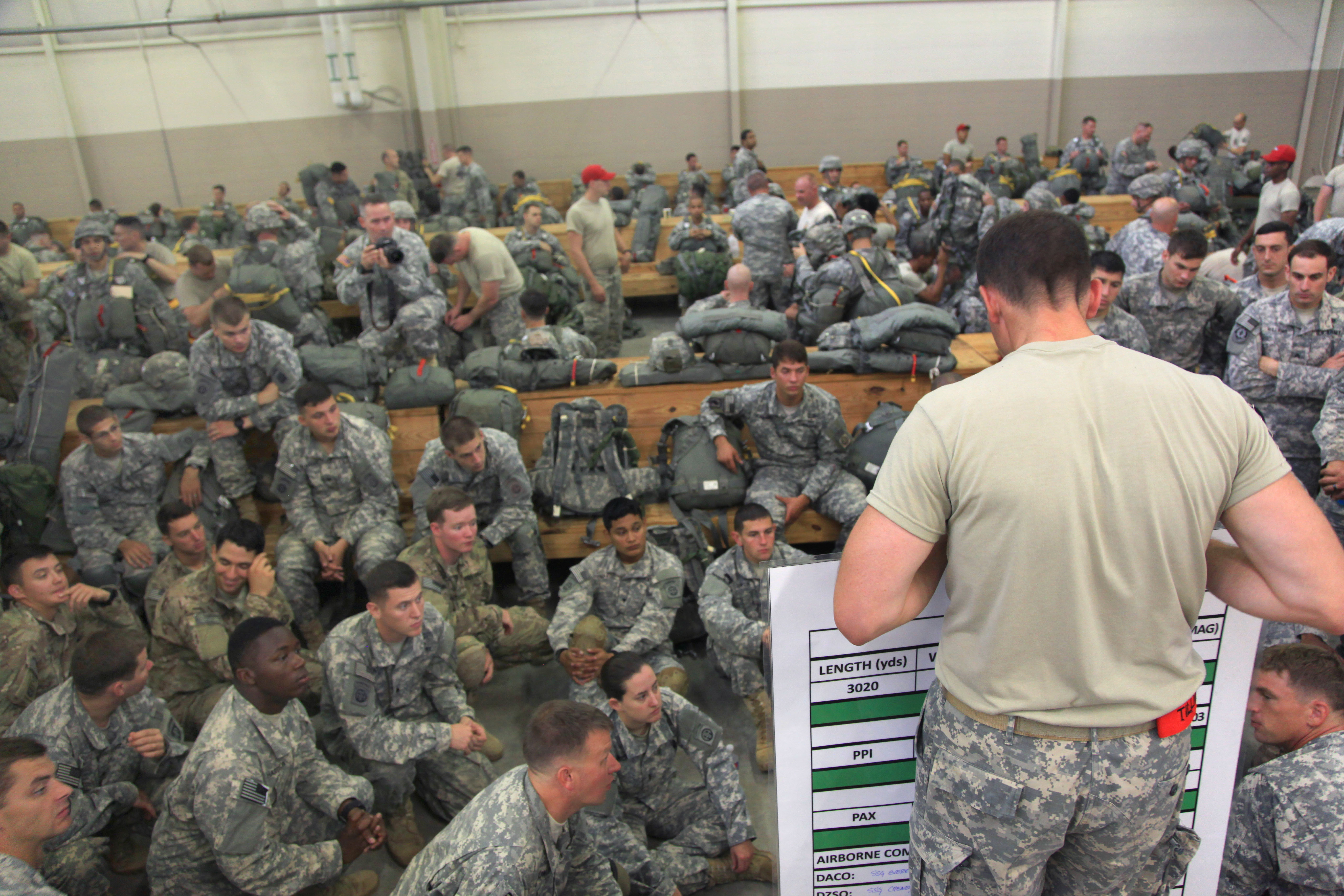 Army Capt. Paul Tillman, foreground, gives a mission brief to his ...