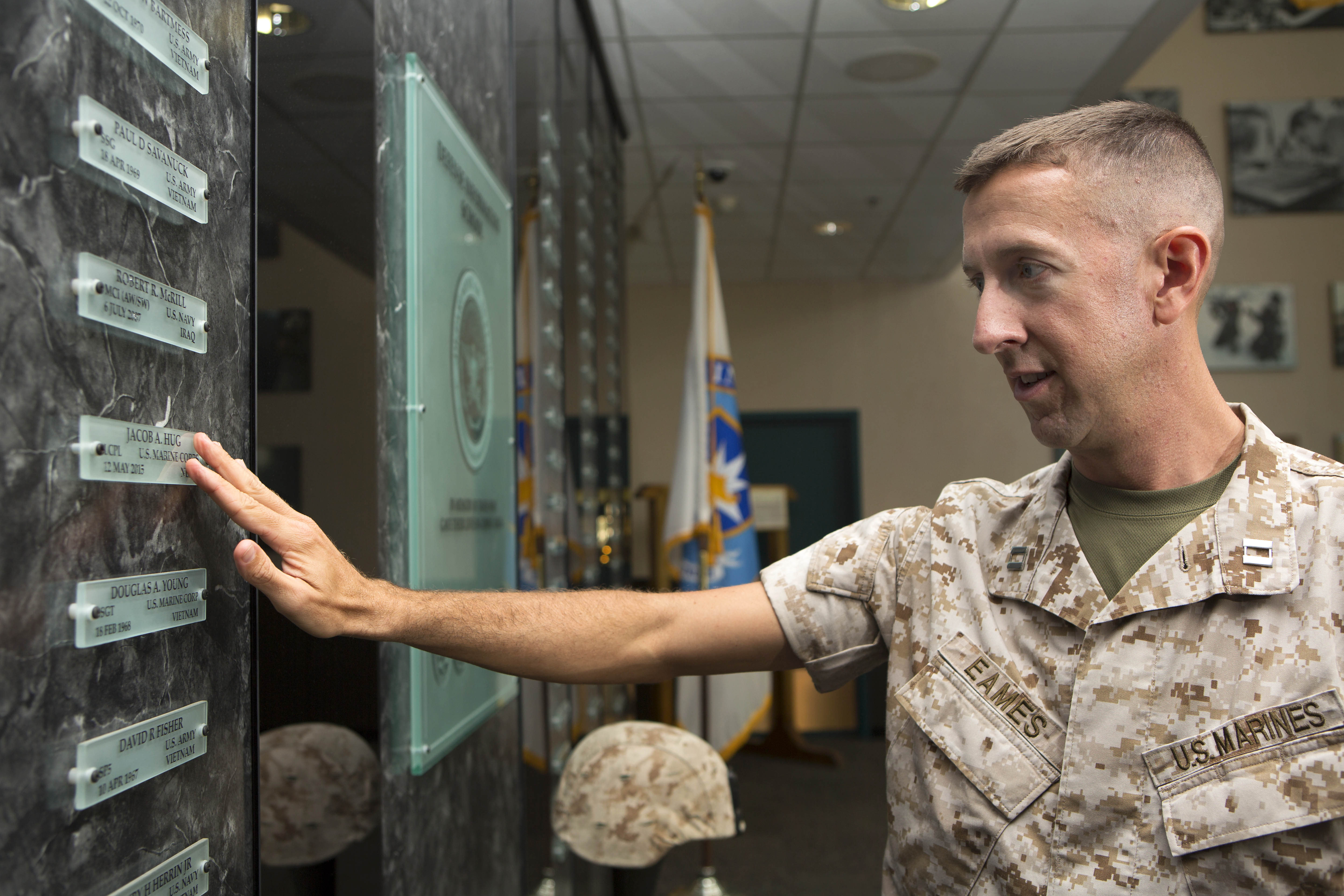Marine Corps Capt. Caleb Eames touches the name plate for Lance Cpl ...
