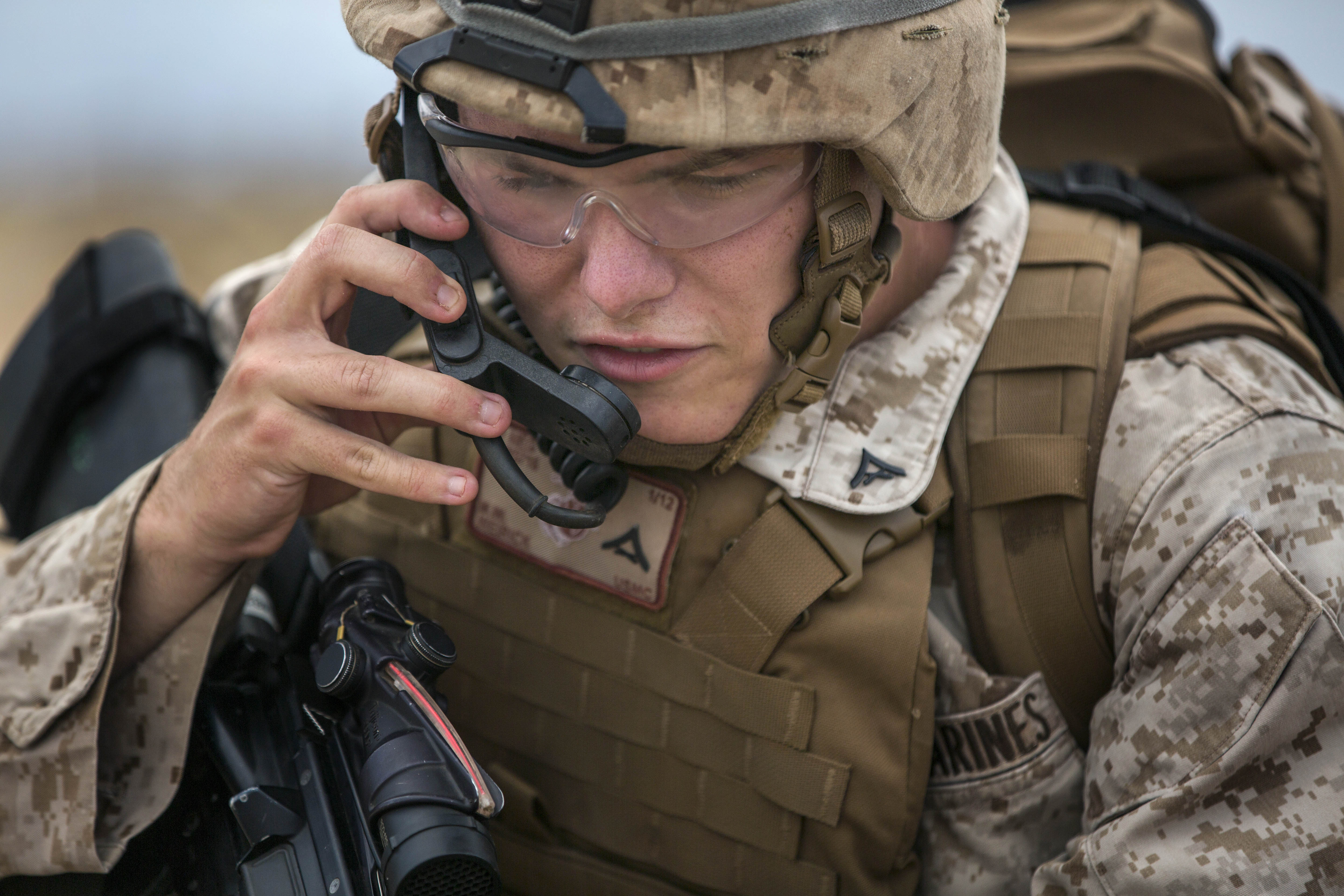 Marine Corps Lance Cpl. Mathew Weirick calls for fire support while ...