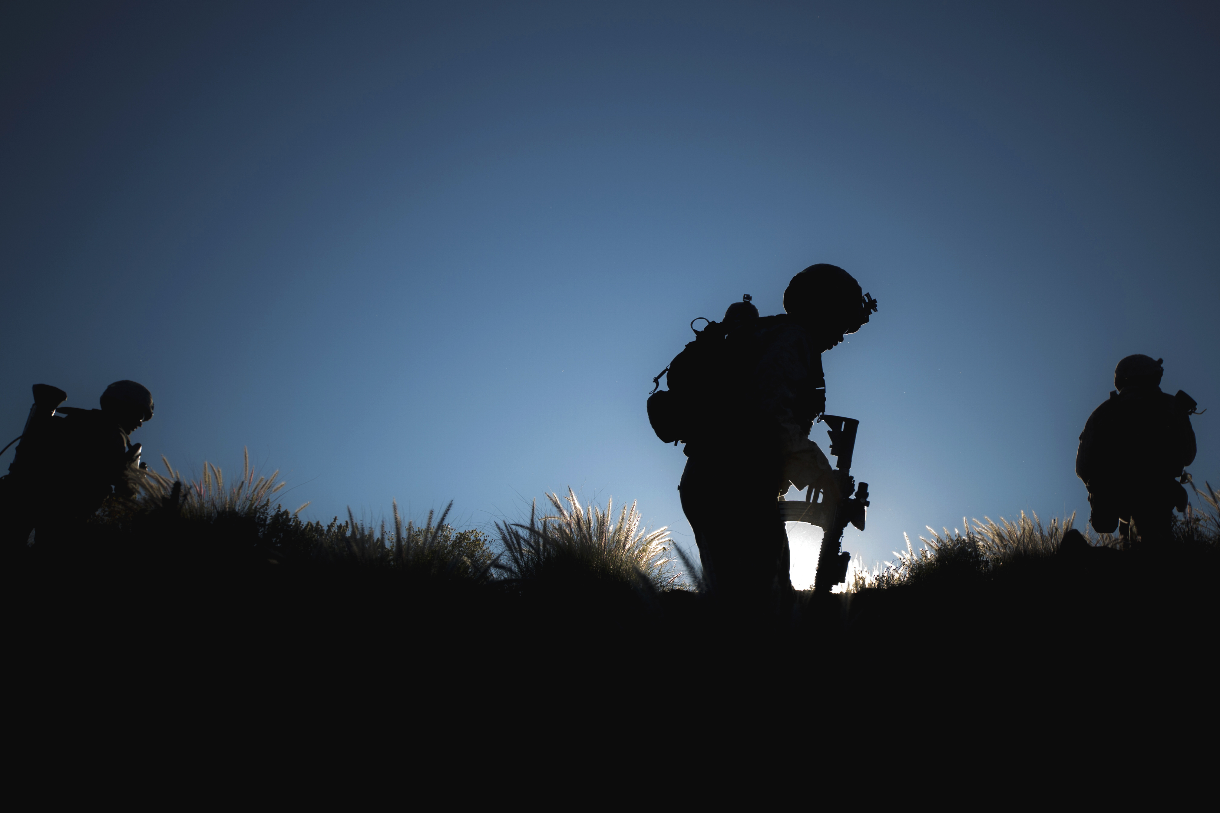 Marines take positions on a ridge during Operation Lava Viper at ...