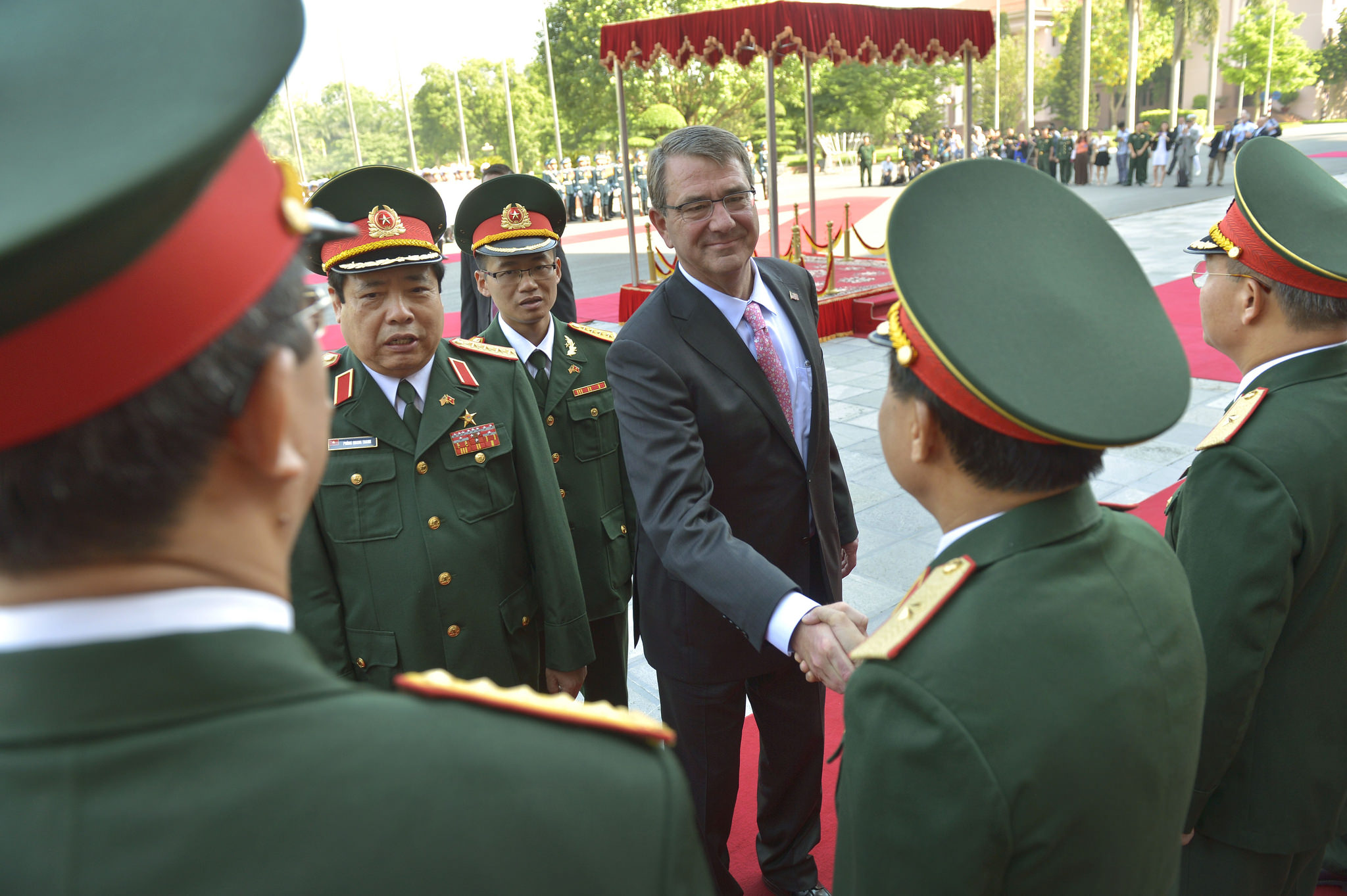 U.S. Defense Secretary Ash Carter, right, shakes hands with senior ...
