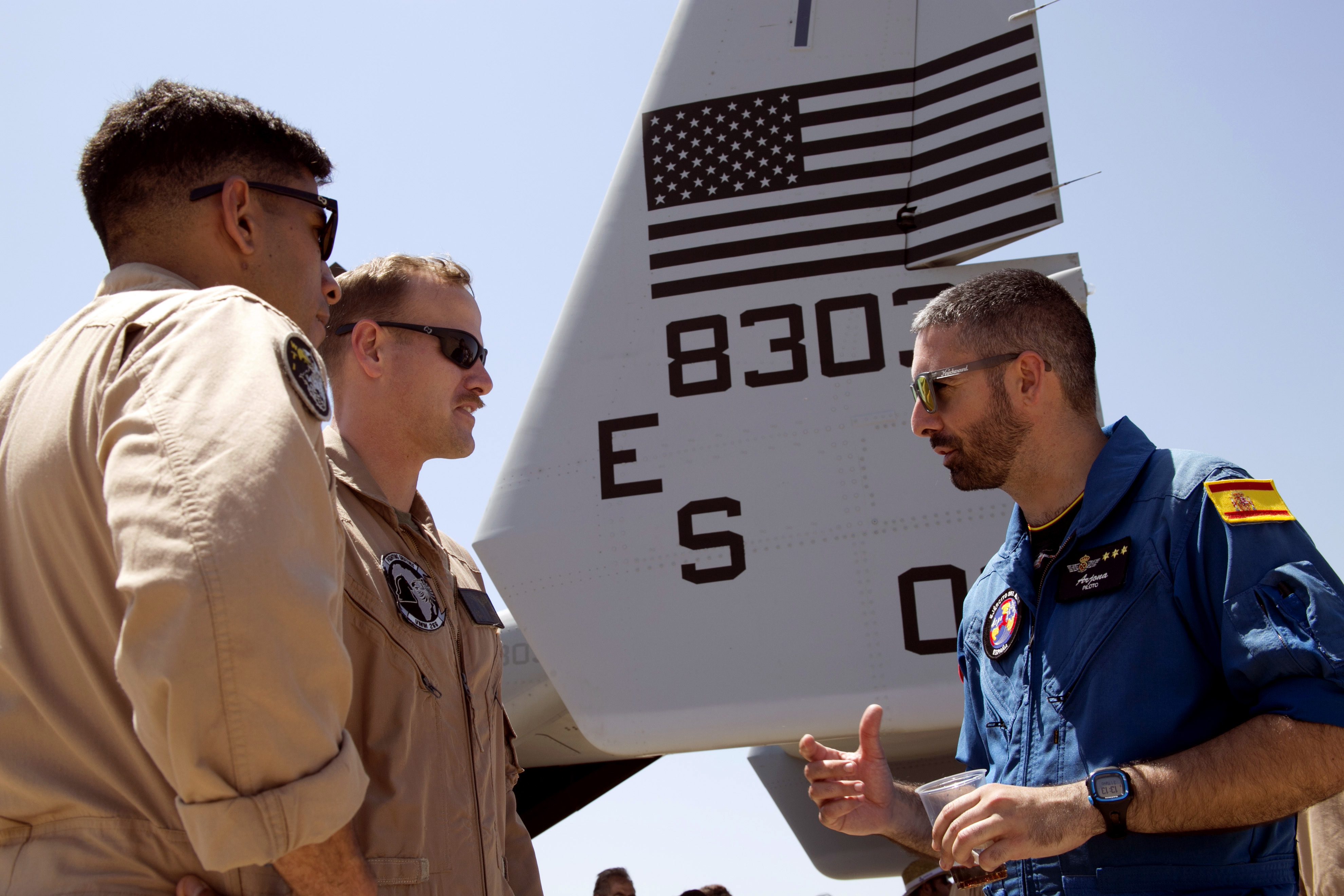 A Spanish pilot, right, asks U.S. Marine MV-22 Osprey pilots, Capt ...
