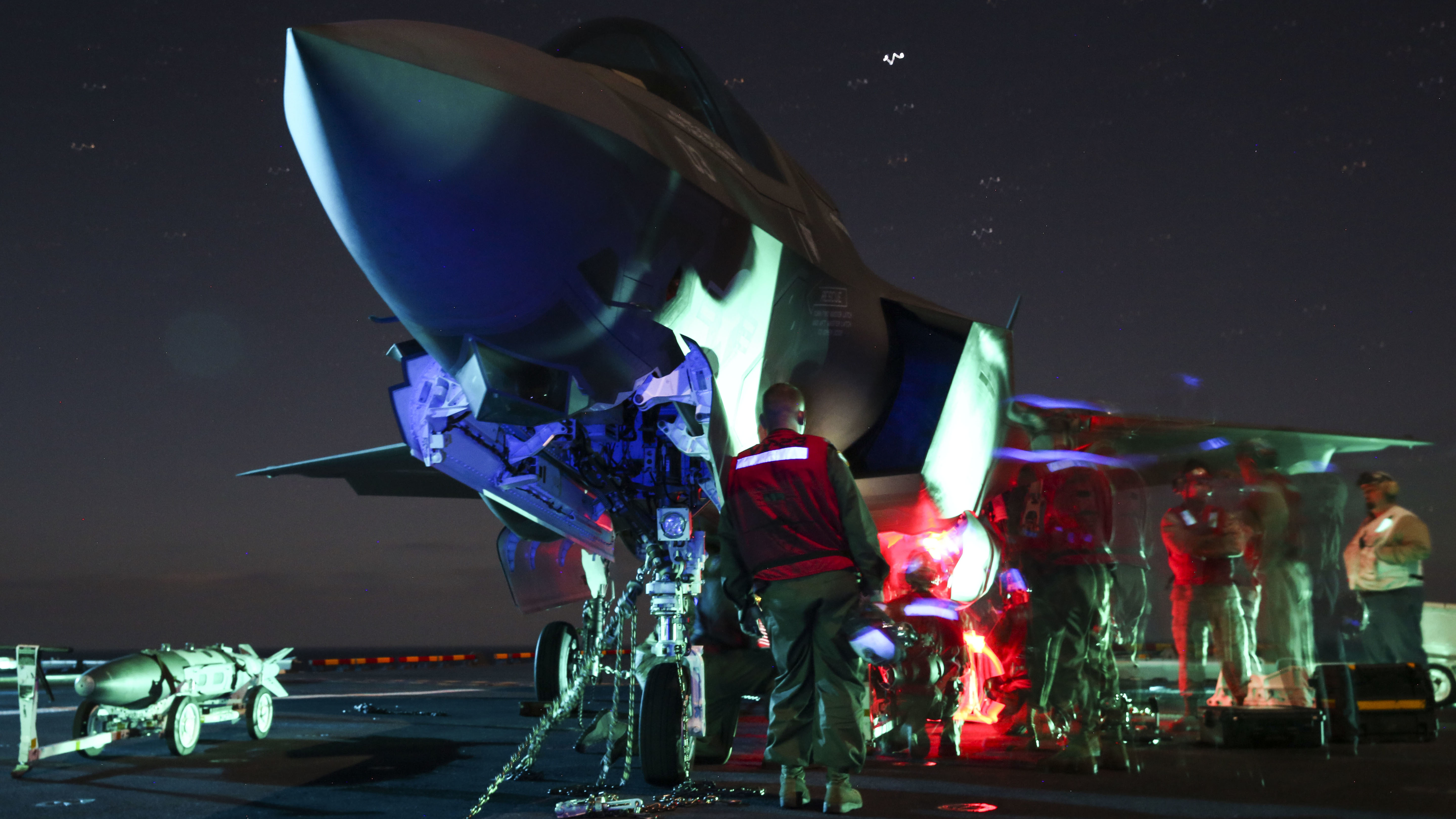 Marines conduct night ordnance load on F-35B at sea