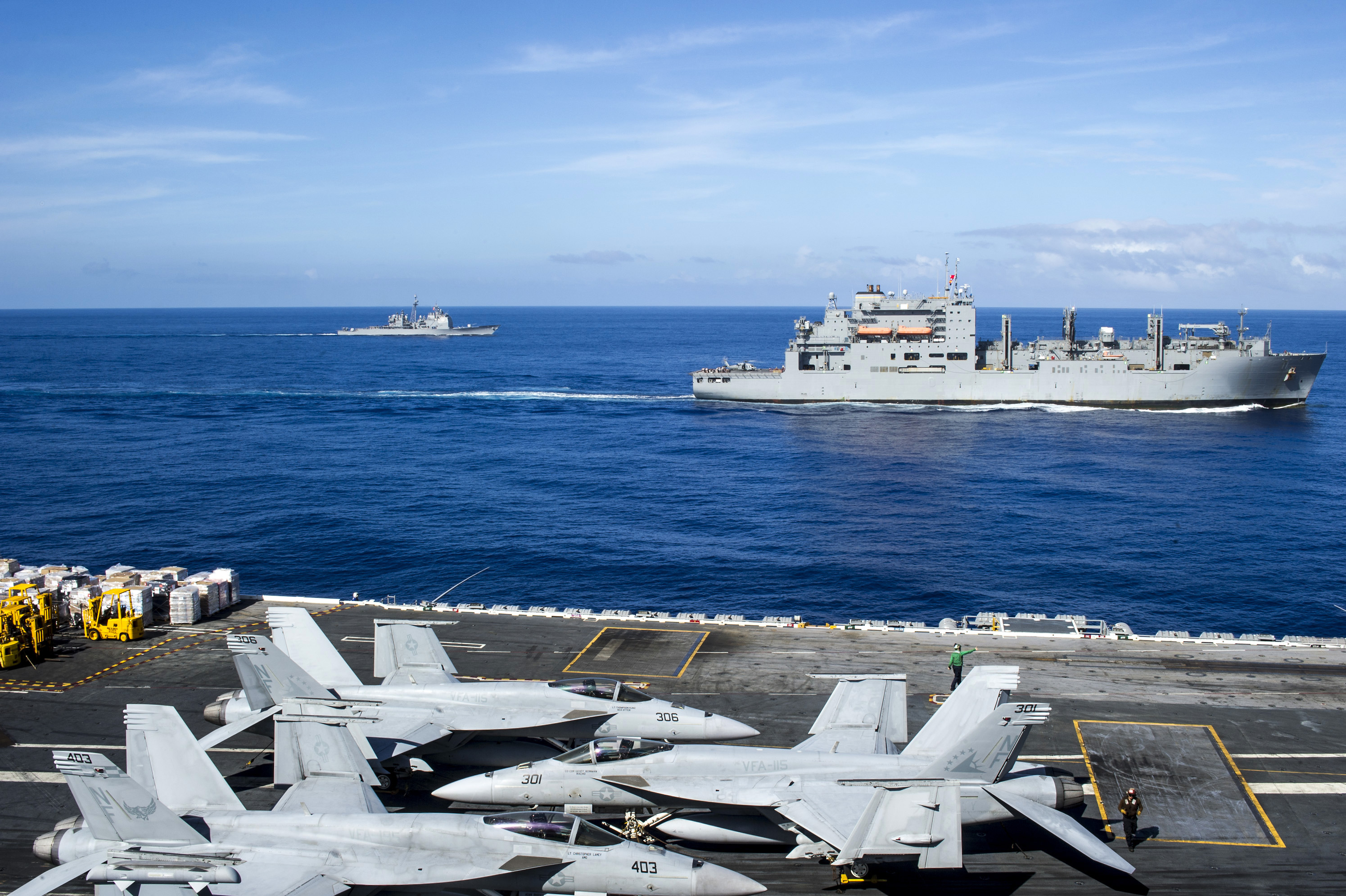 The guided missile cruiser USS Antietam, left, and the Military Sealift ...