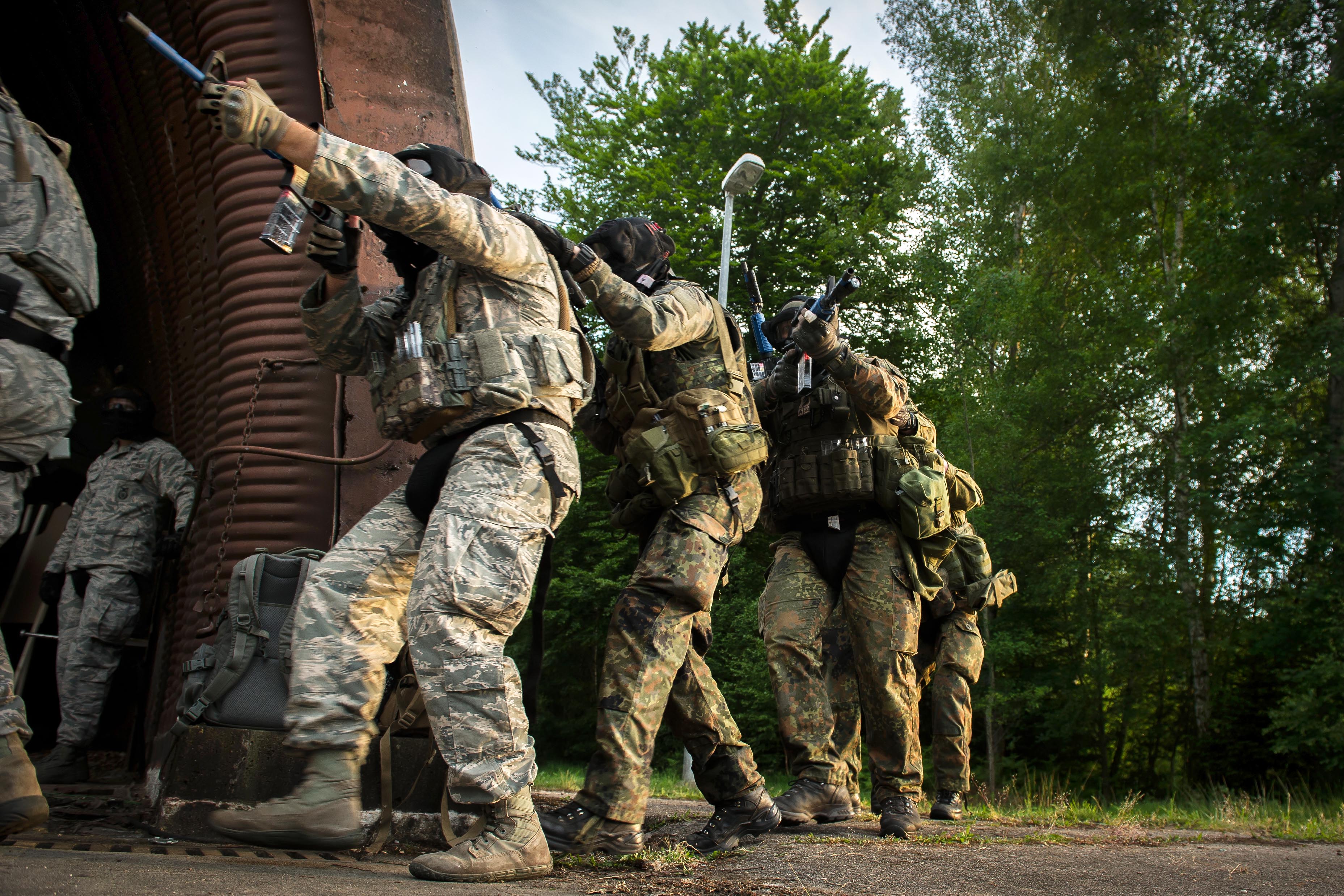 U.S. and NATO troops move into position to breach a hardened facility ...