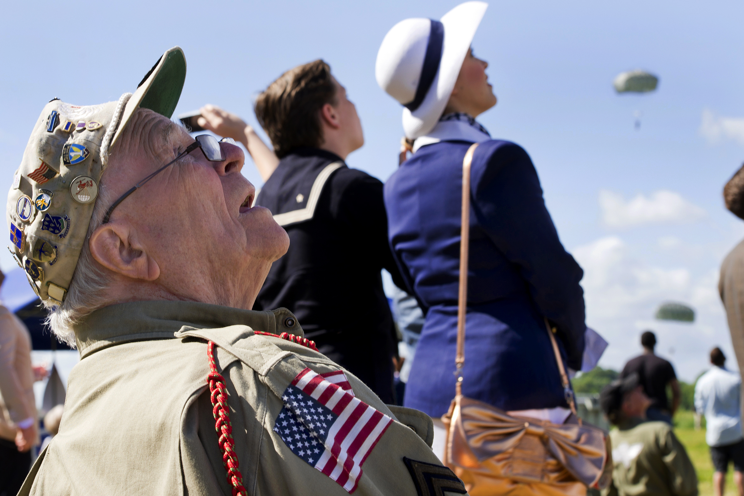 George Shenkle, World War II veteran and former U.S. soldier, reacts as ...