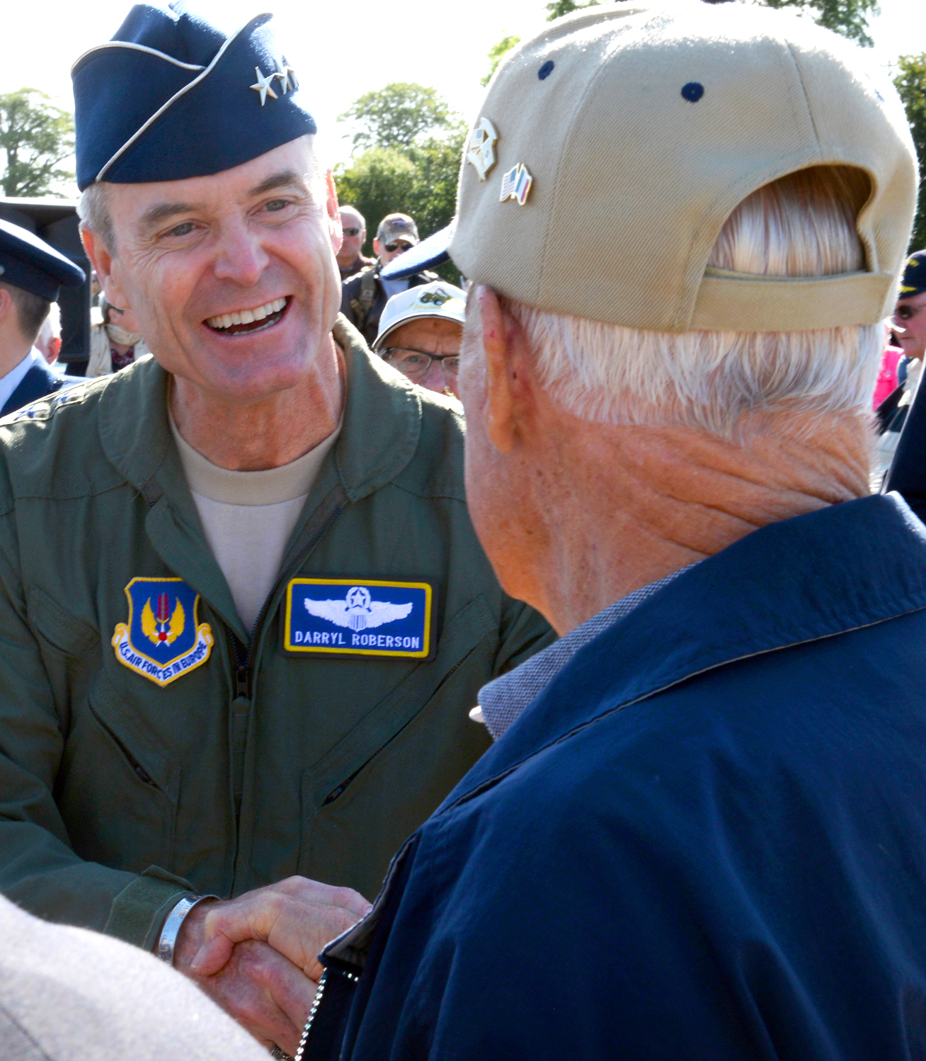 U.S. Air Force Lt. Gen. Darryl Roberson greets a World War II veteran ...
