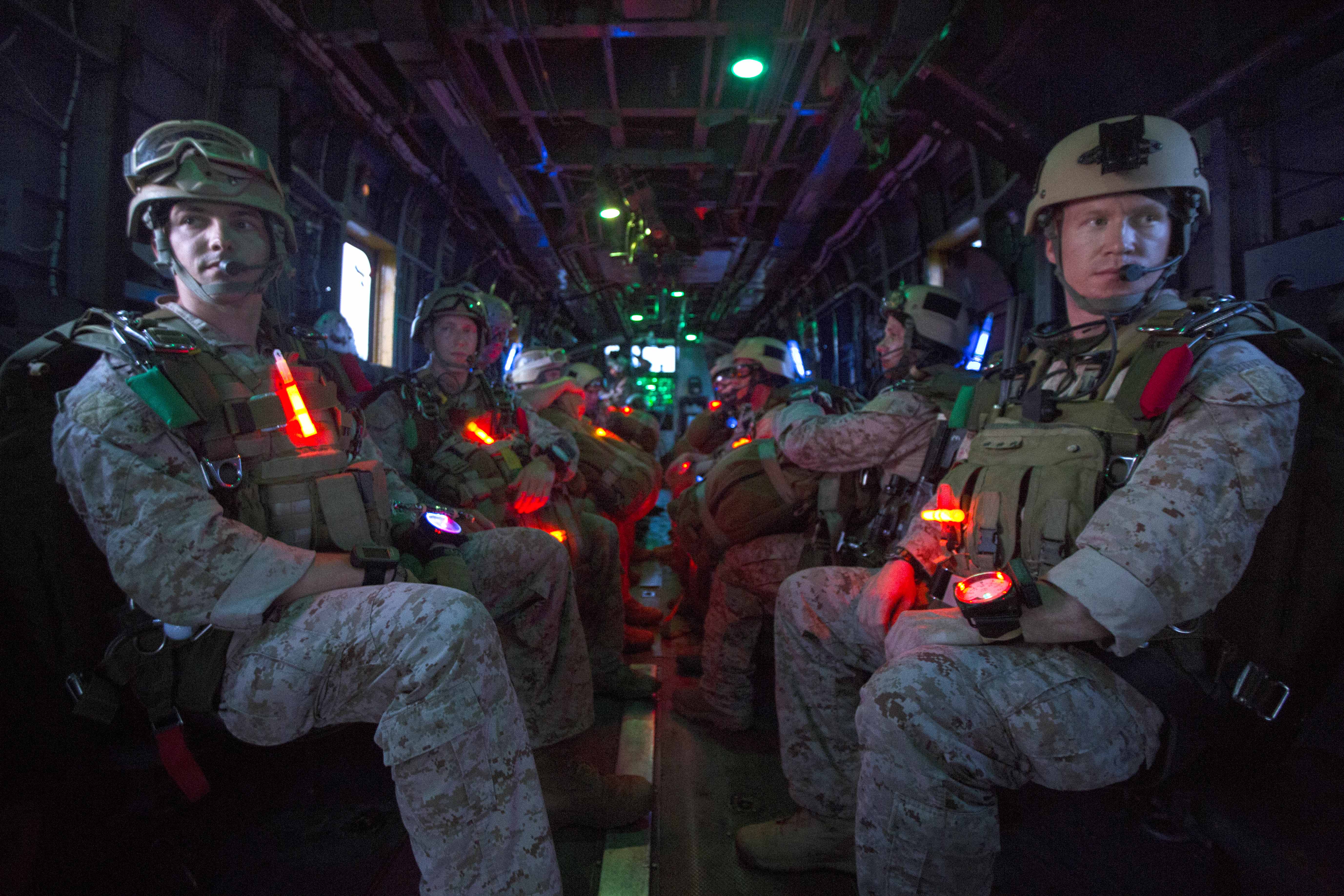 Marines prepare to conduct a high-altitude, high-opening jump from a CH ...