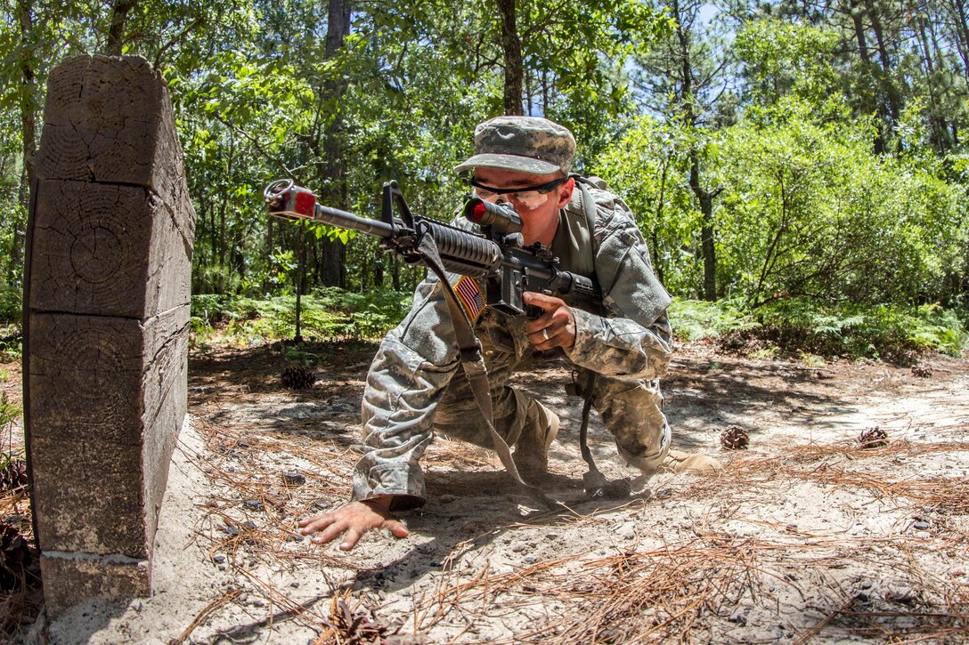 Army Pvt. Oliver Lewis uses a three-second rush to get to cover at the ...