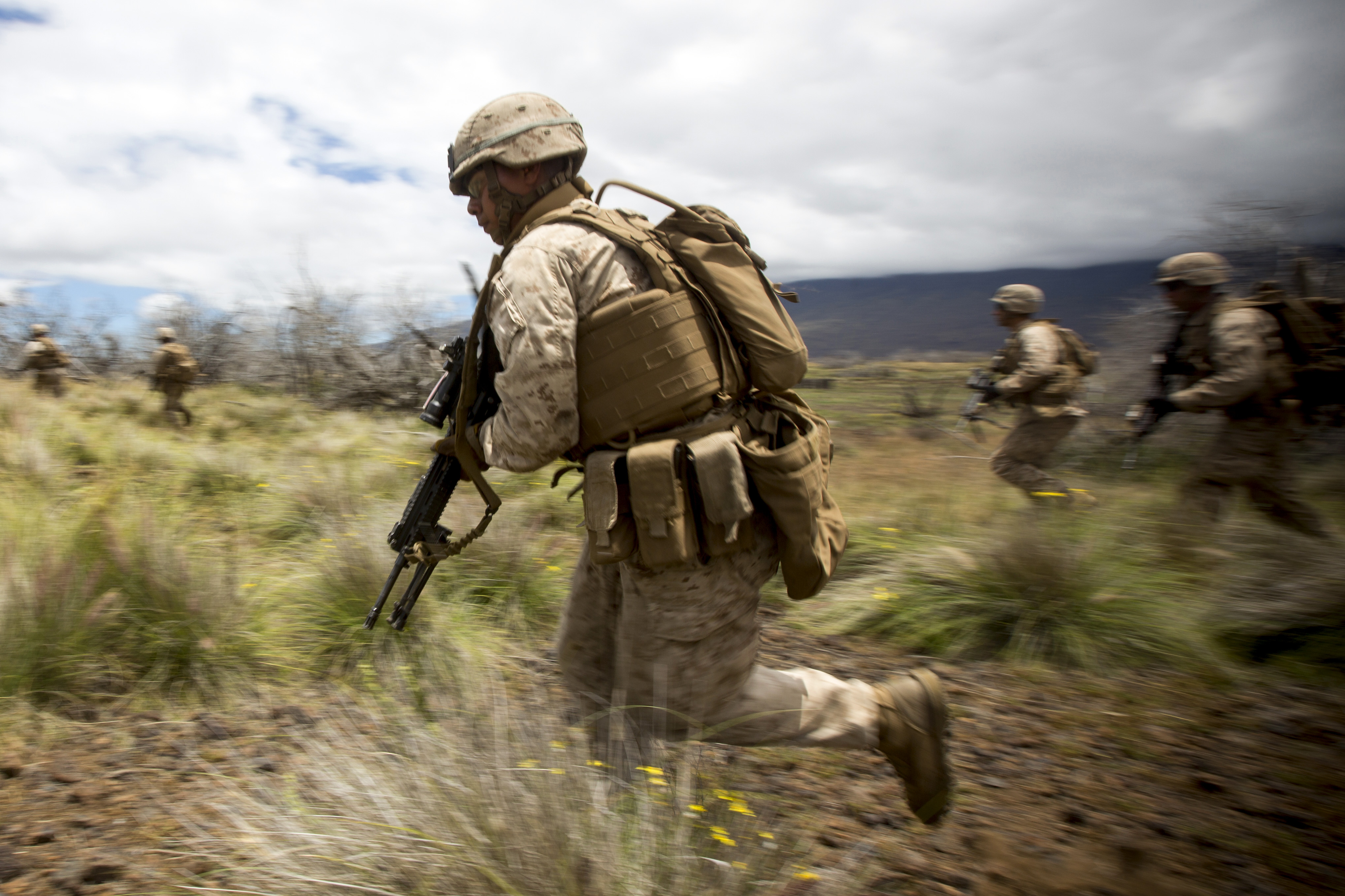 Marines advance toward their next objective during Operation Lava Viper ...