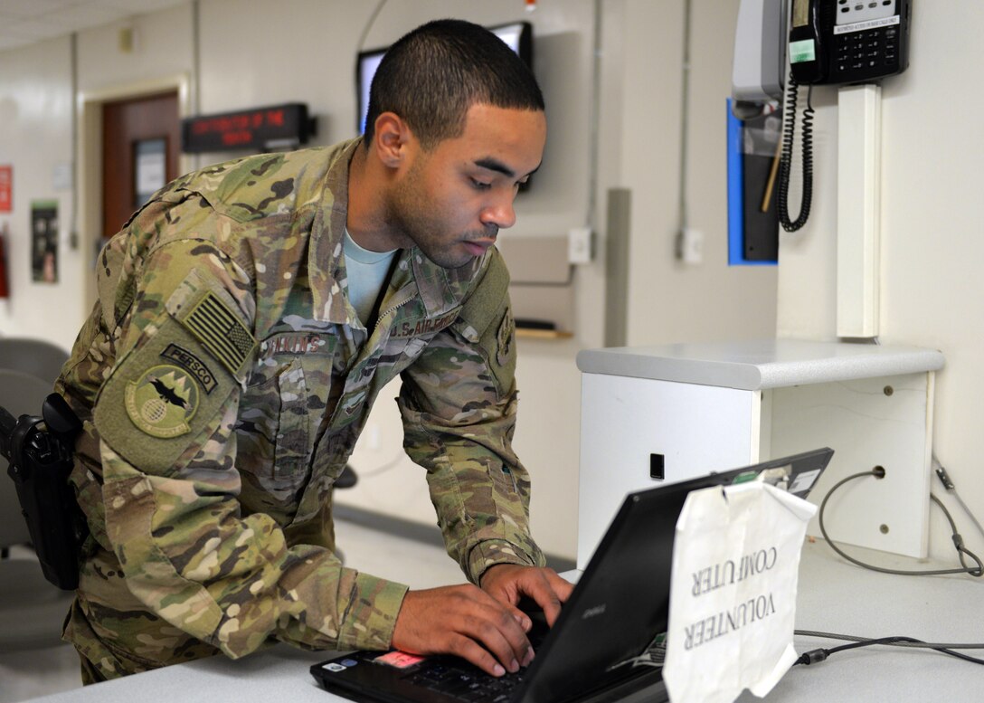 U.S. Air Force Airman 1st Class Torrey Jenkins logs his volunteer hours ...