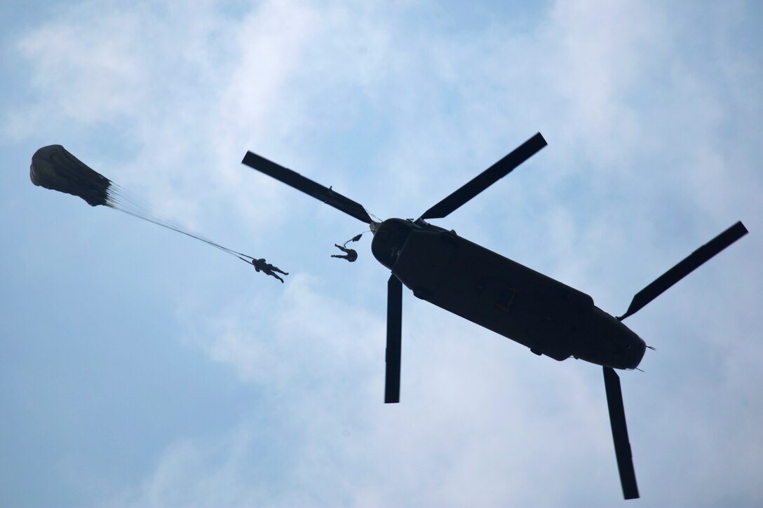 Army Reserve soldiers and Air Force guardsmen perform an airborne jump ...