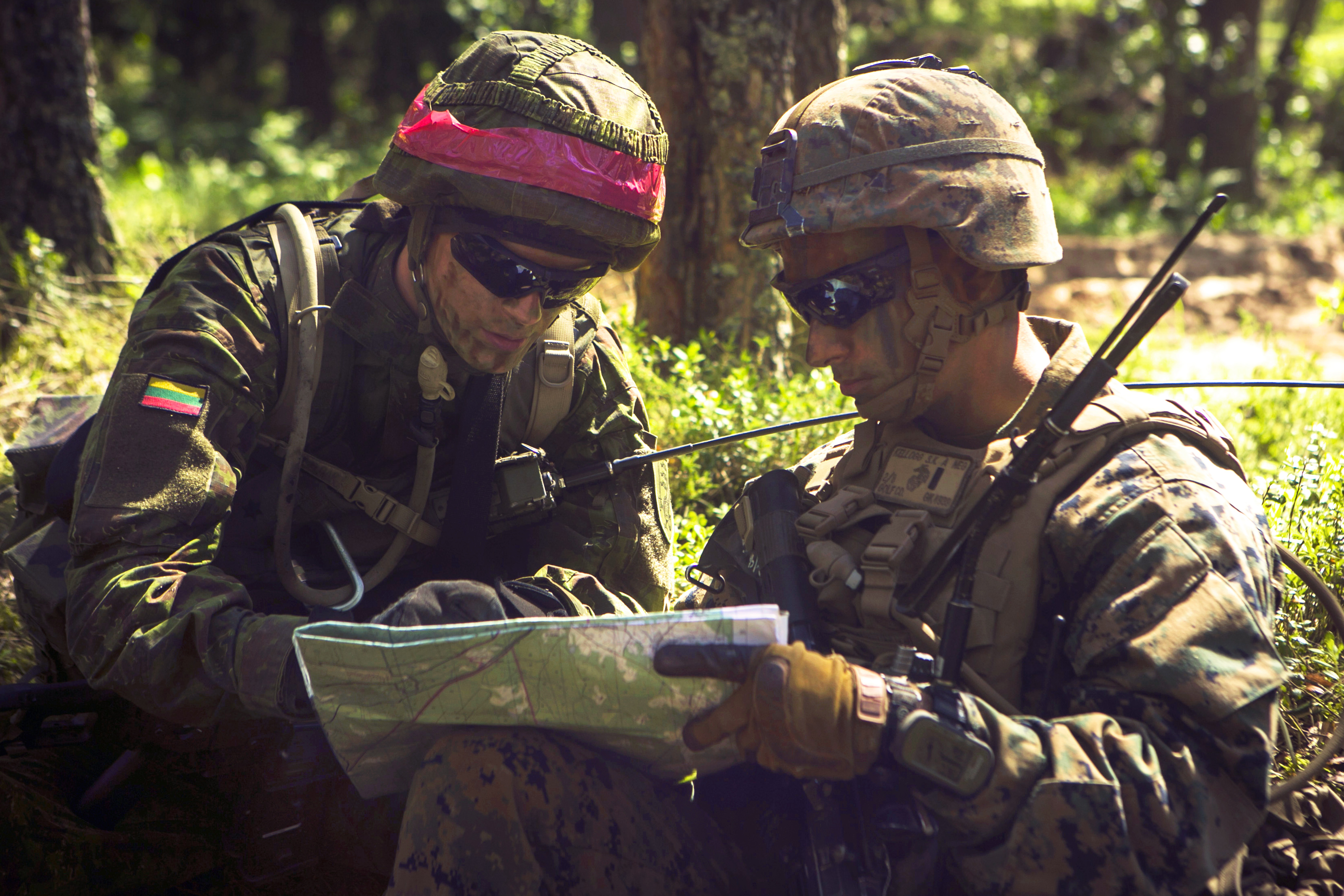 U.S. Marine Corps 1st Lt. Kellogg, right, discusses map coordinates ...