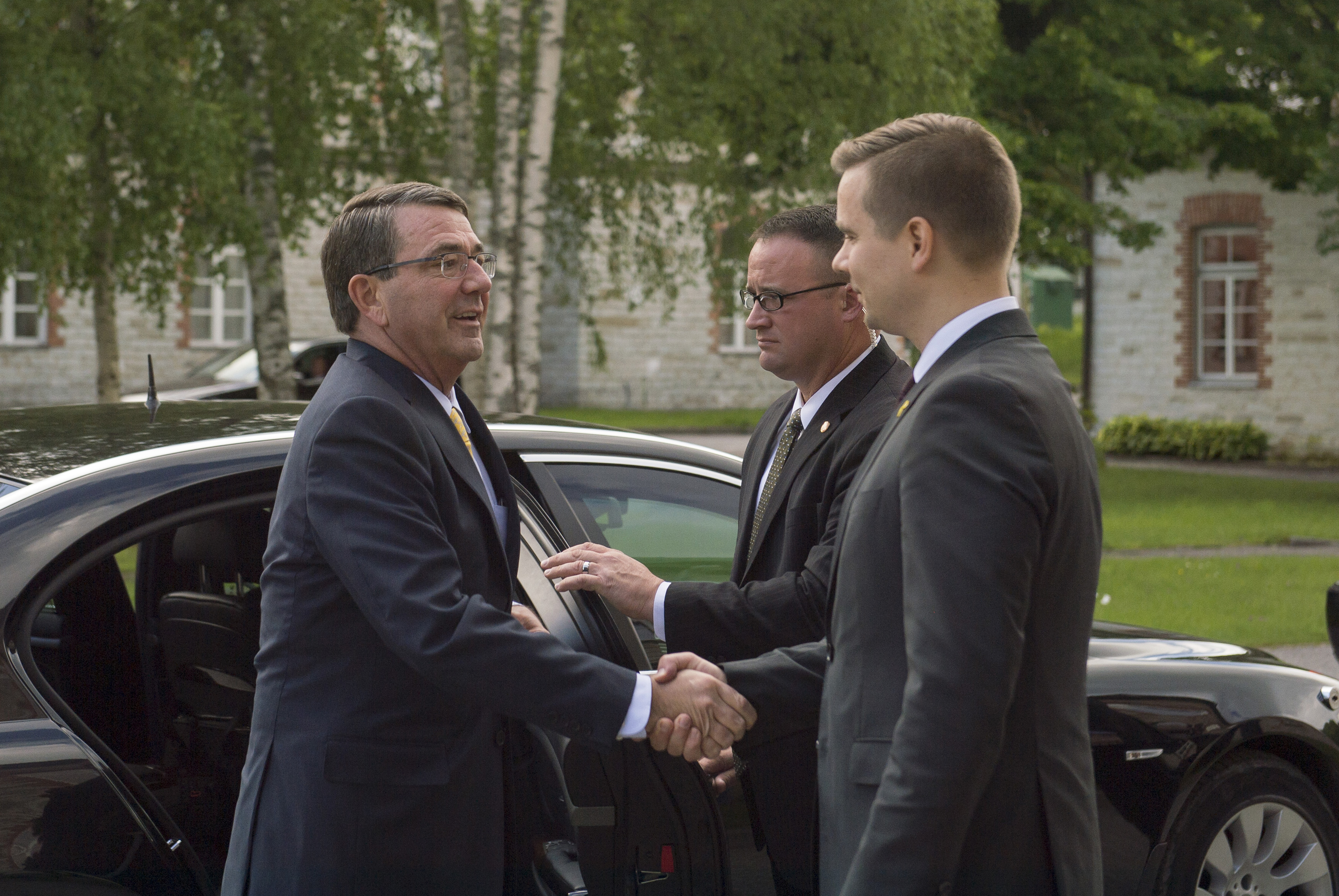 U.S. Defense Secretary Ash Carter, left, shakes hands with Mikk Marran ...