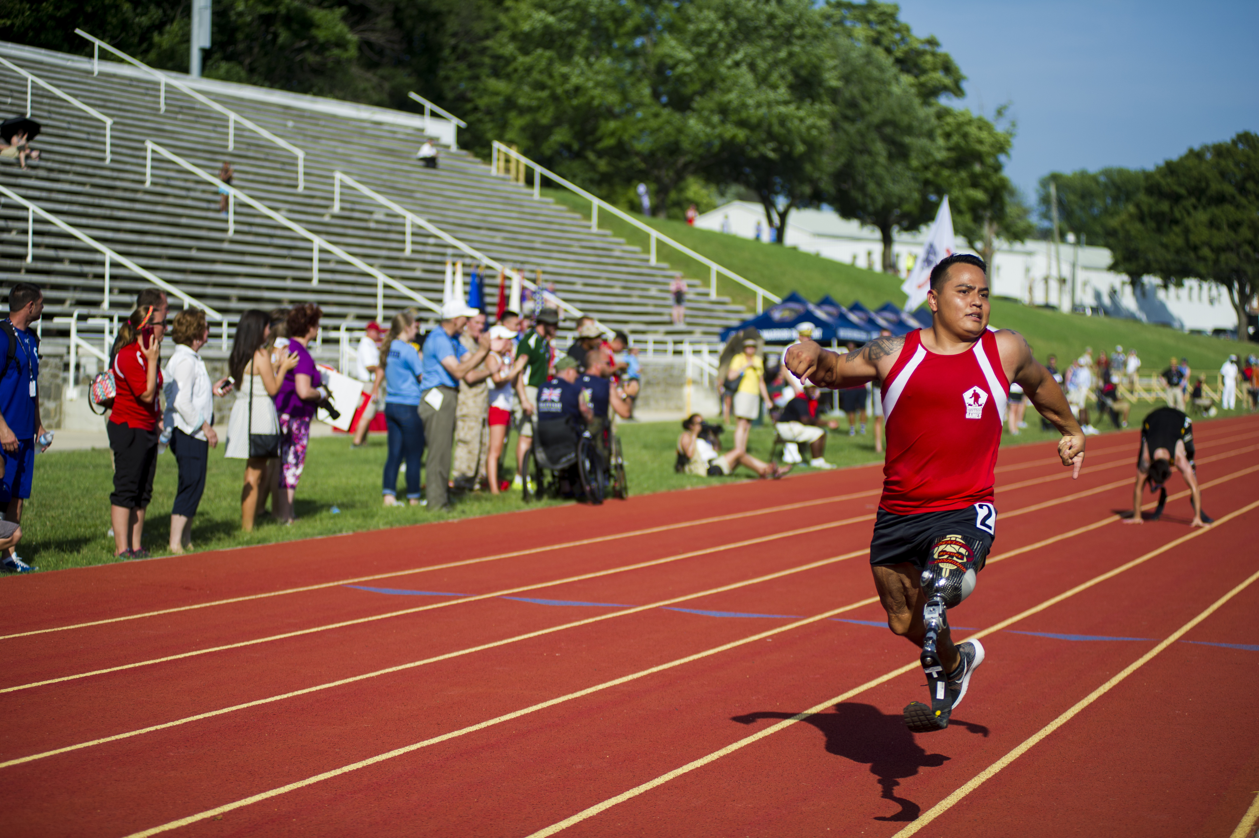 U.S. Marine Cpl. Marcus Chischilly competes in the 100-meter sprint ...